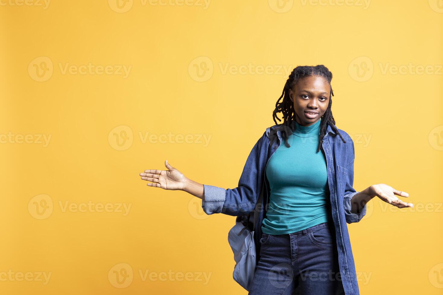Uncaring woman doing shrugging shoulders gesture, showing indifference ...