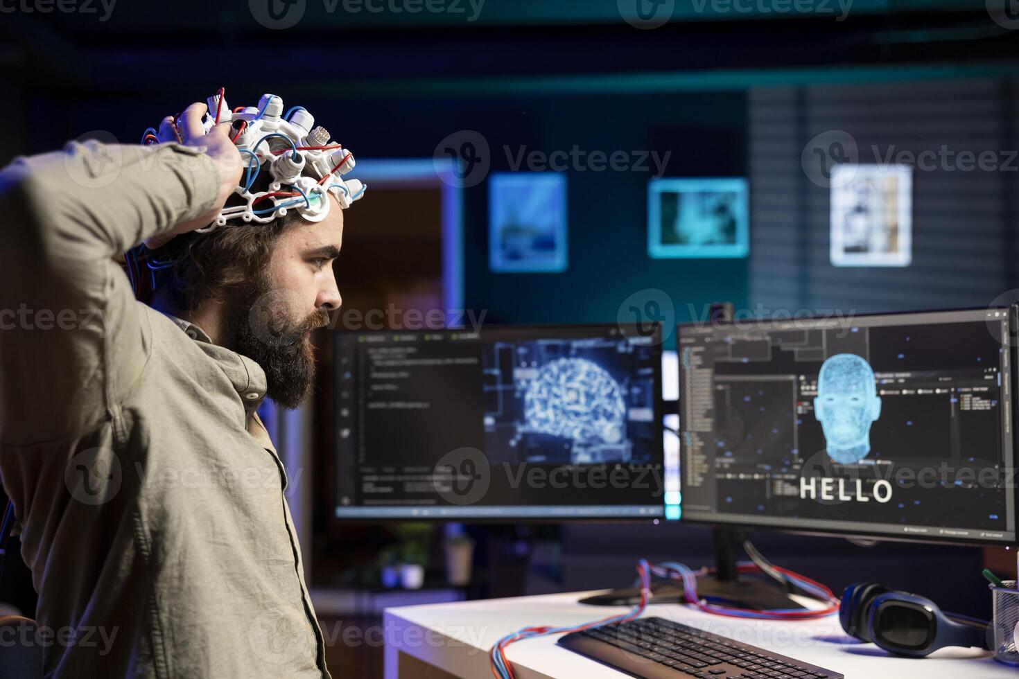 Man placing EEG headset on head to communicate with artificial intelligence entity with ...