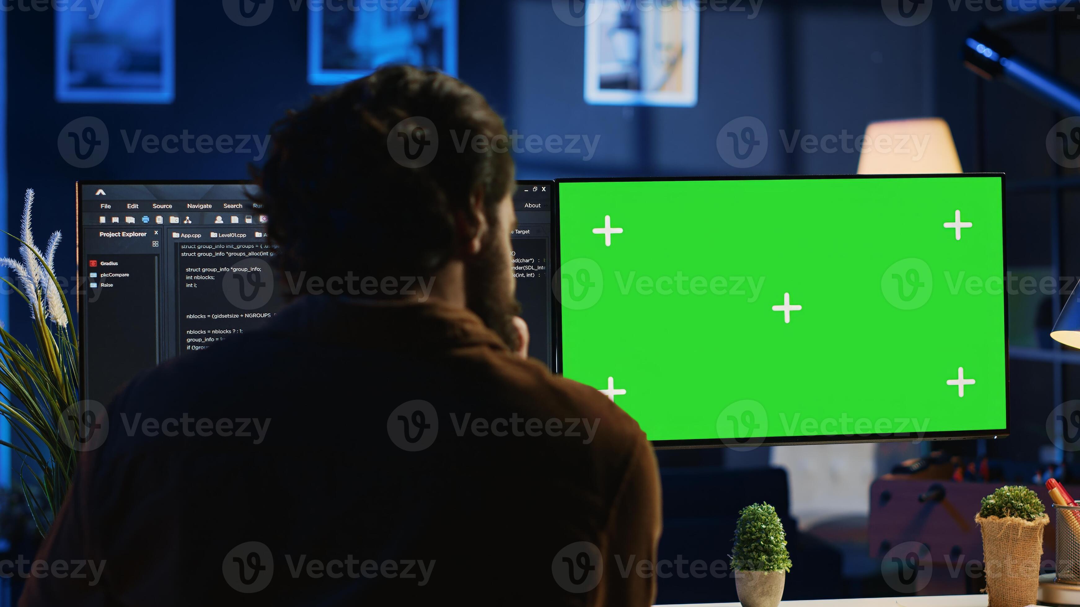 Programmer Typing Complex Code On Green Screen Computer In Neon Lit Home Office Developing 8473