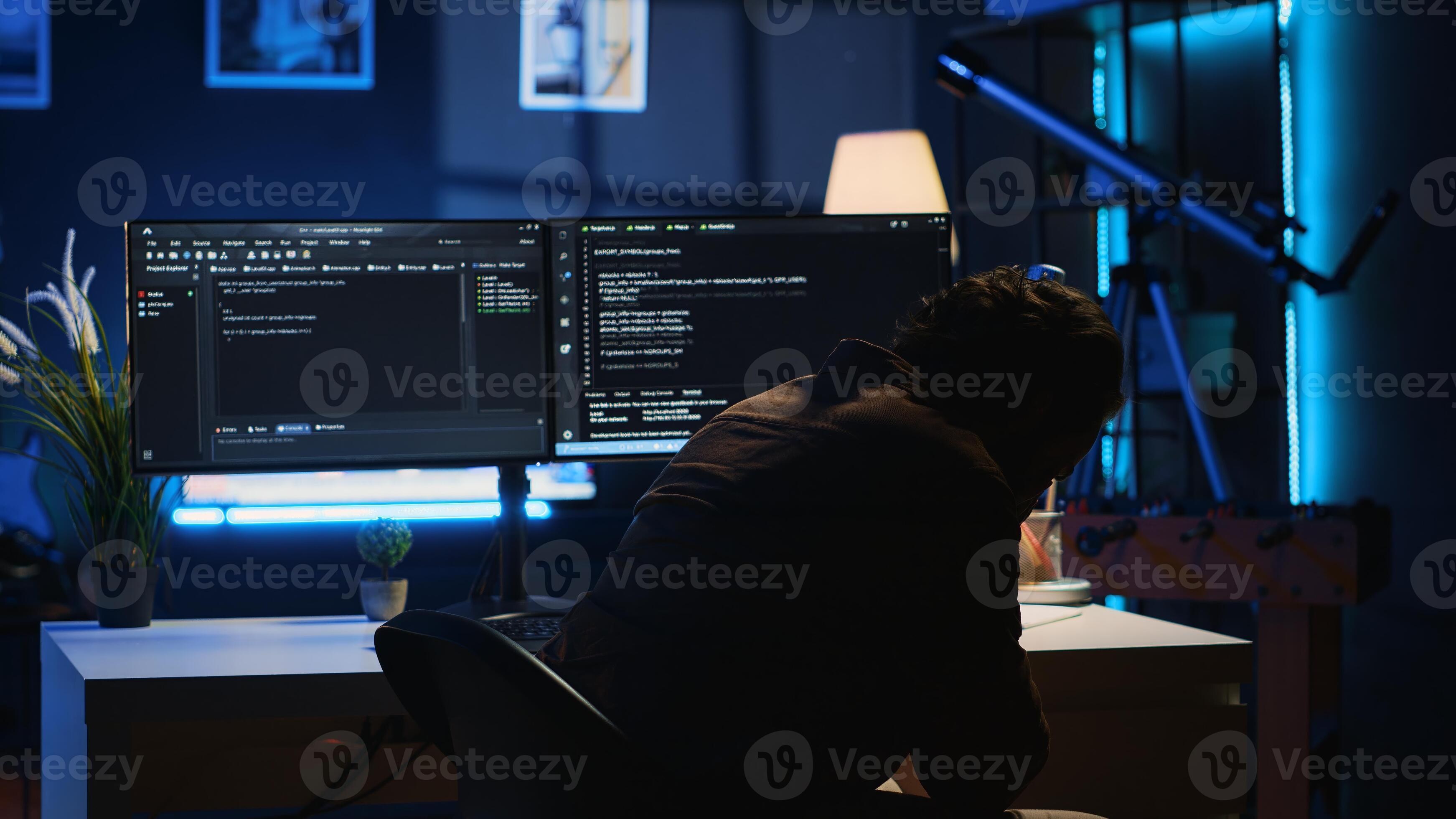Software Developer Putting Face In Hands In Frustration While Updating Binary Code Script On