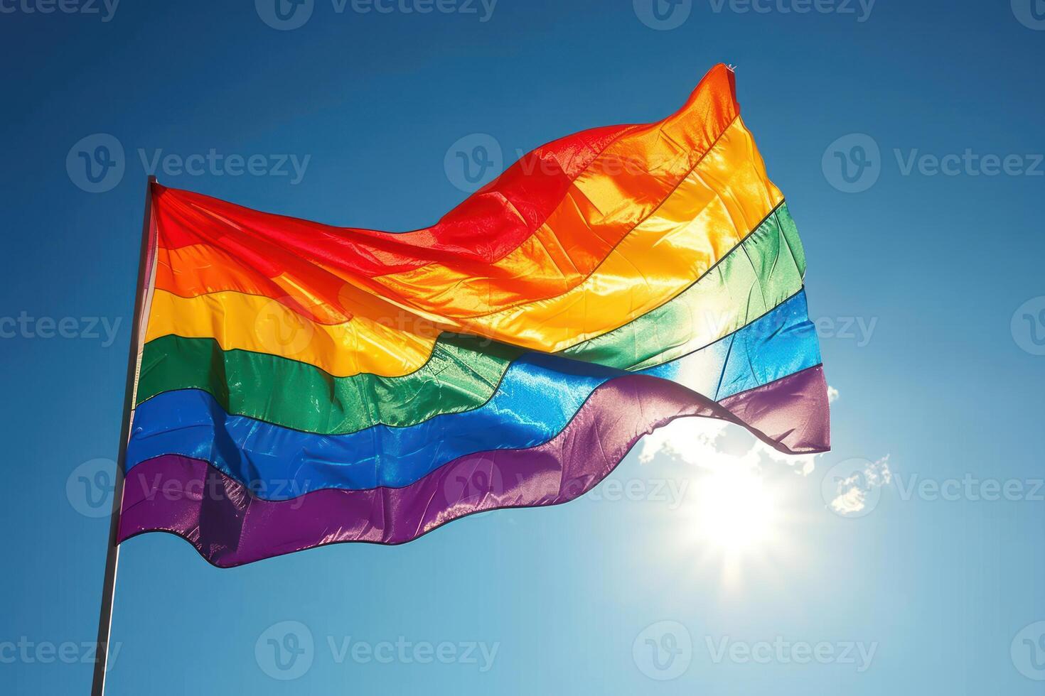 the rainbow flag is blowing in the wind underneath the sun, 48495076 ...