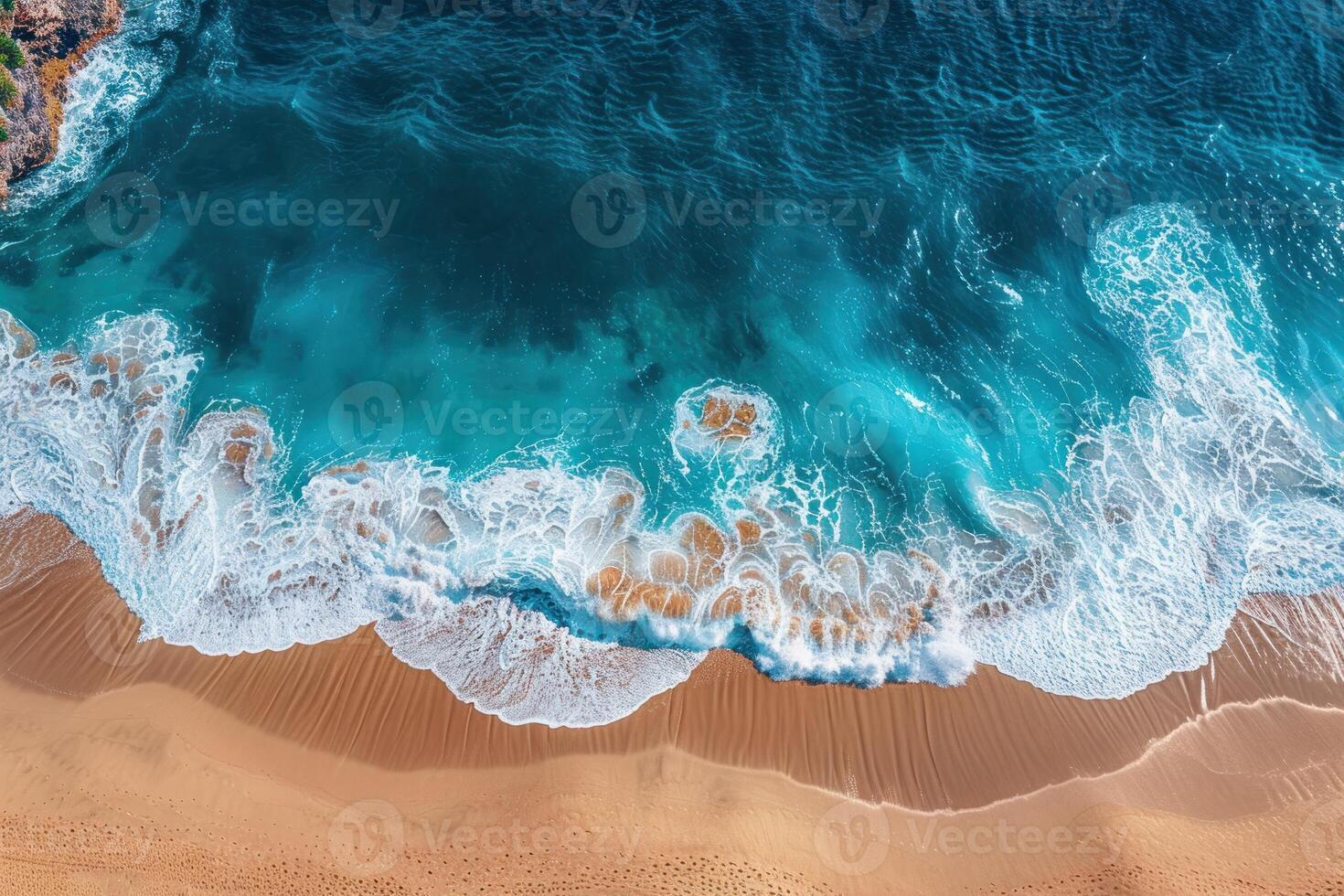 top down aerial view of blue sea with large waves hitting shore ... top down aerial view of blue sea with large waves hitting shore ...