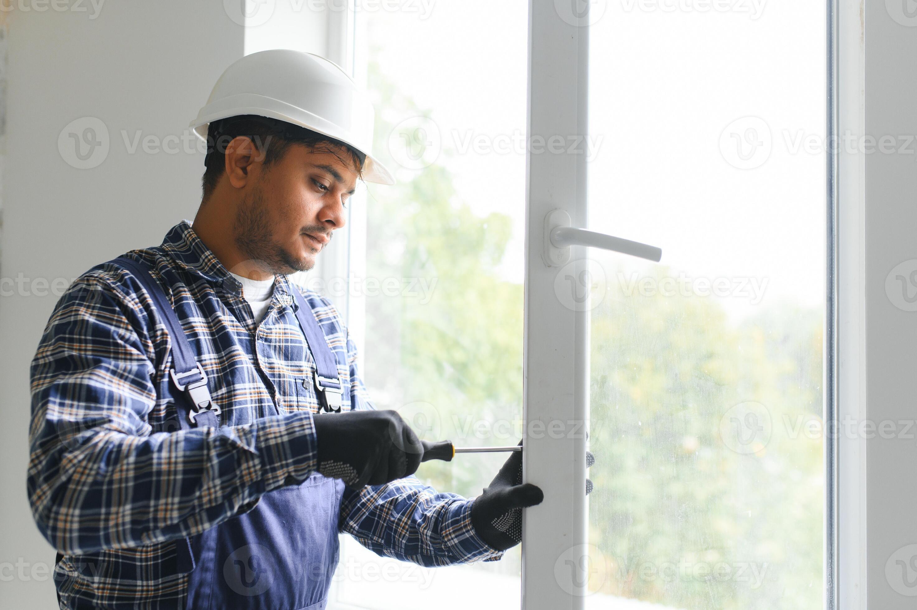 Indian service man installing window with screwdriver 48569468 Stock ... Indian service man installing window with screwdriver 48569468 Stock ...