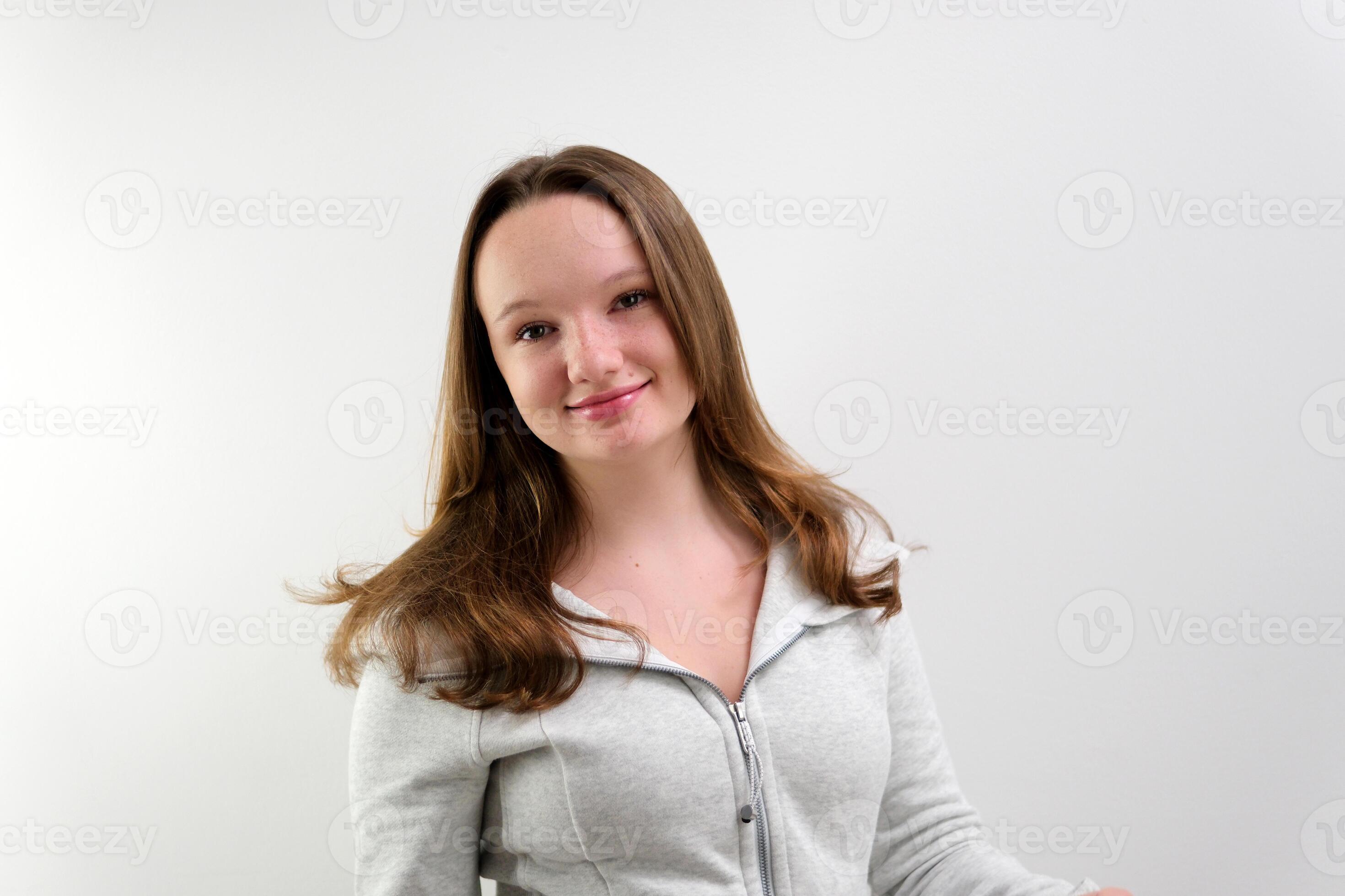 Dreaming girl Cute girl smiles in slow motion and straightens her awesome brunette hairstyle ...