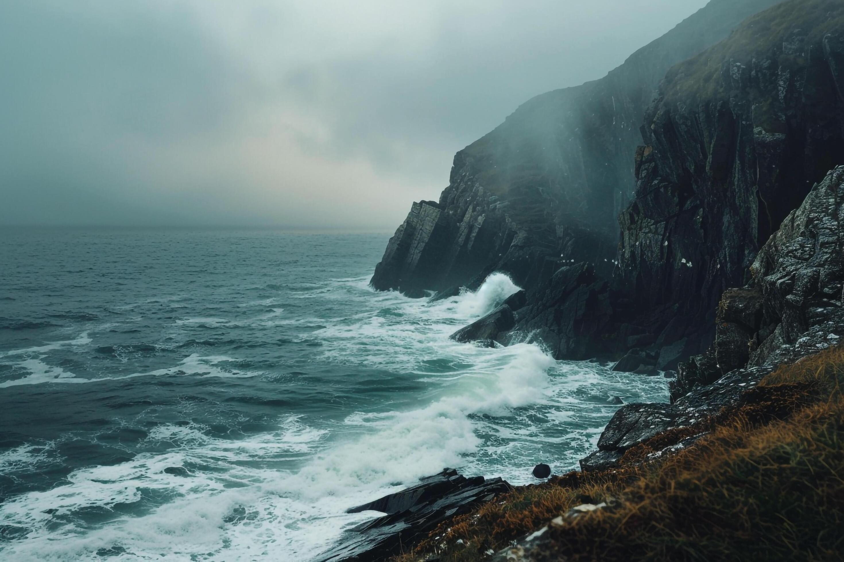 Coastal with Gentle Waves Crashing Against Rocky Cliffs Under Moody ... Coastal with Gentle Waves Crashing Against Rocky Cliffs Under Moody ...