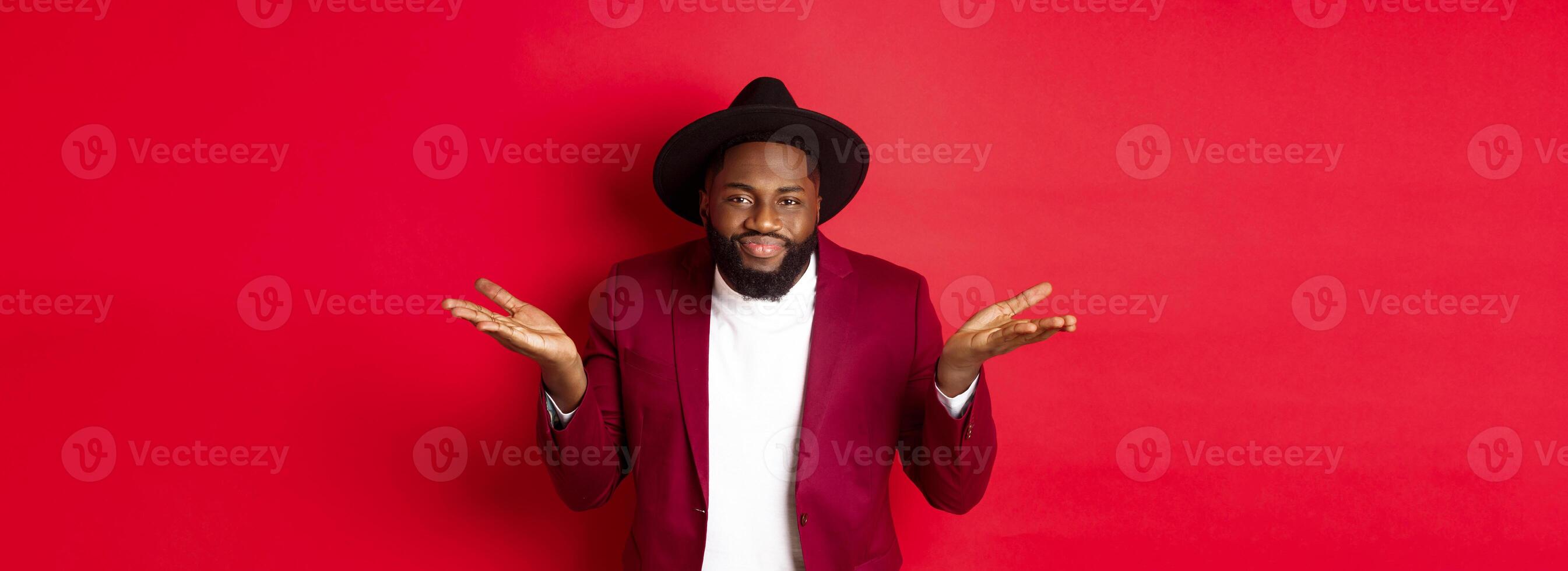 Clueless and unbothered Black man shrugging with indifferent look, dont ...