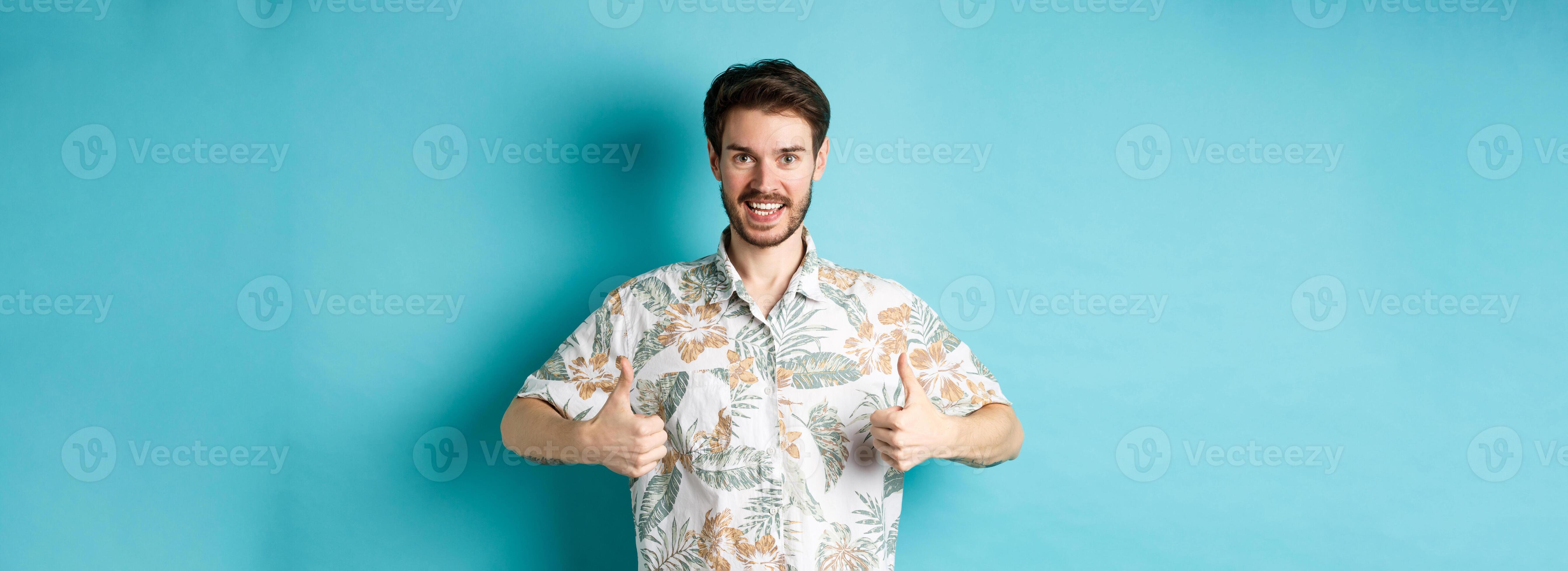 Handsome tourist showing thumbs up and say yes, praising good tourism ... Handsome tourist showing thumbs up and say yes, praising good tourism ...