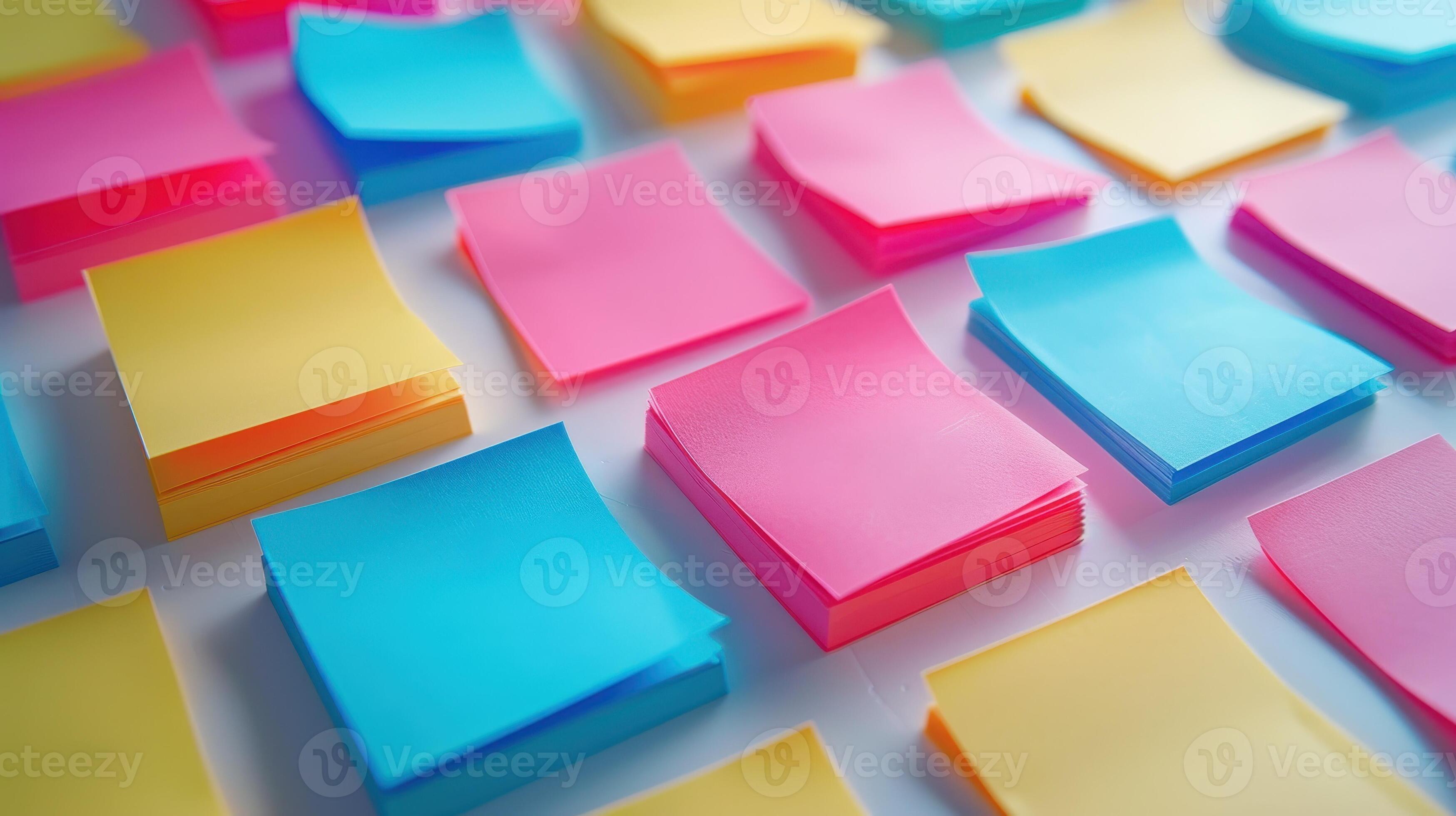 Brightly Colored Sticky Notes Spread Across A Clean White Surface Displaying Creativity And