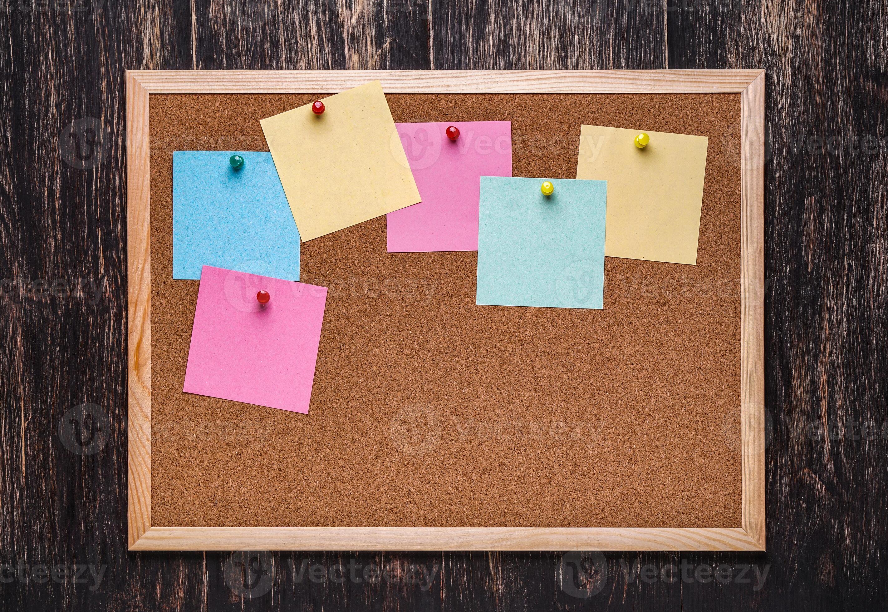 corkboard with pinned multicolored stickers on dark background 48840372 ... corkboard with pinned multicolored stickers on dark background 48840372 ...