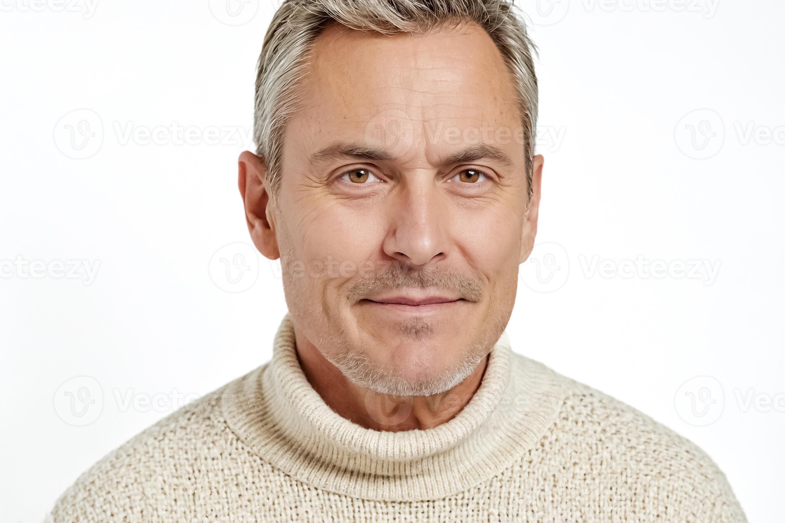 Portrait of a smiling middle-aged man with salt and pepper hair ...
