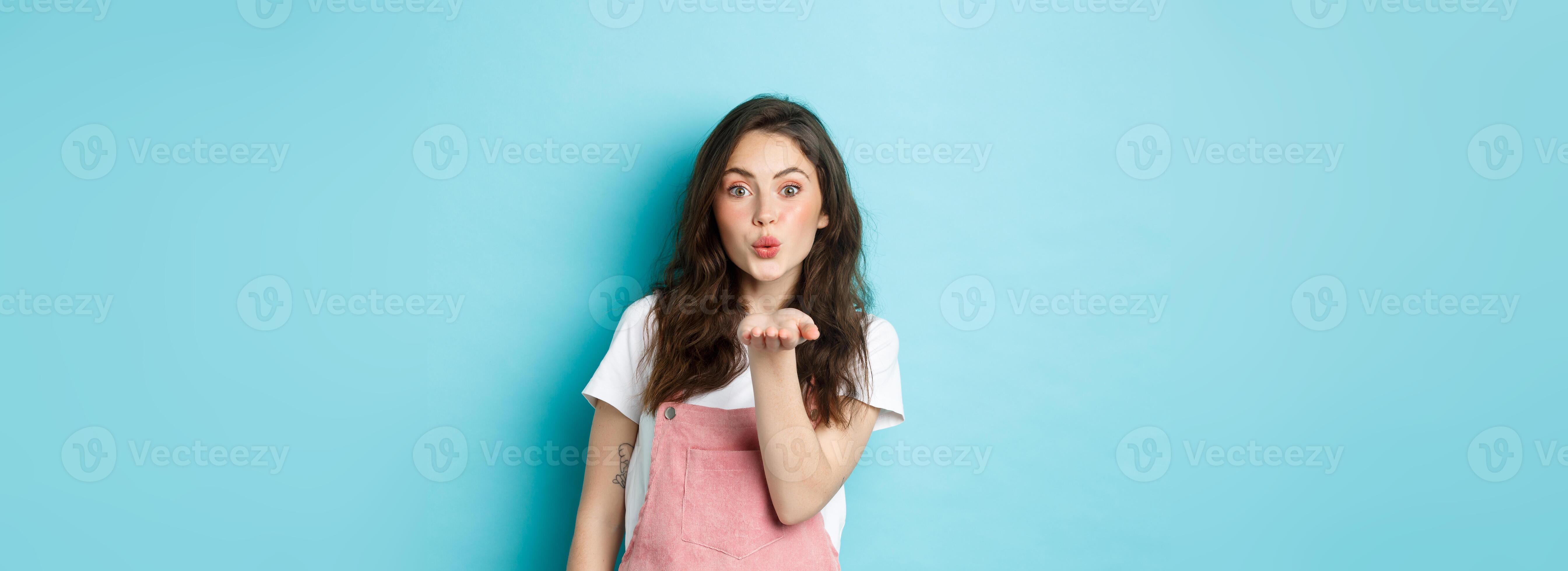Beautiful Girl Blowing Air Kiss With Romantic Face Holding Palm Near Lips And Sending Mwah At