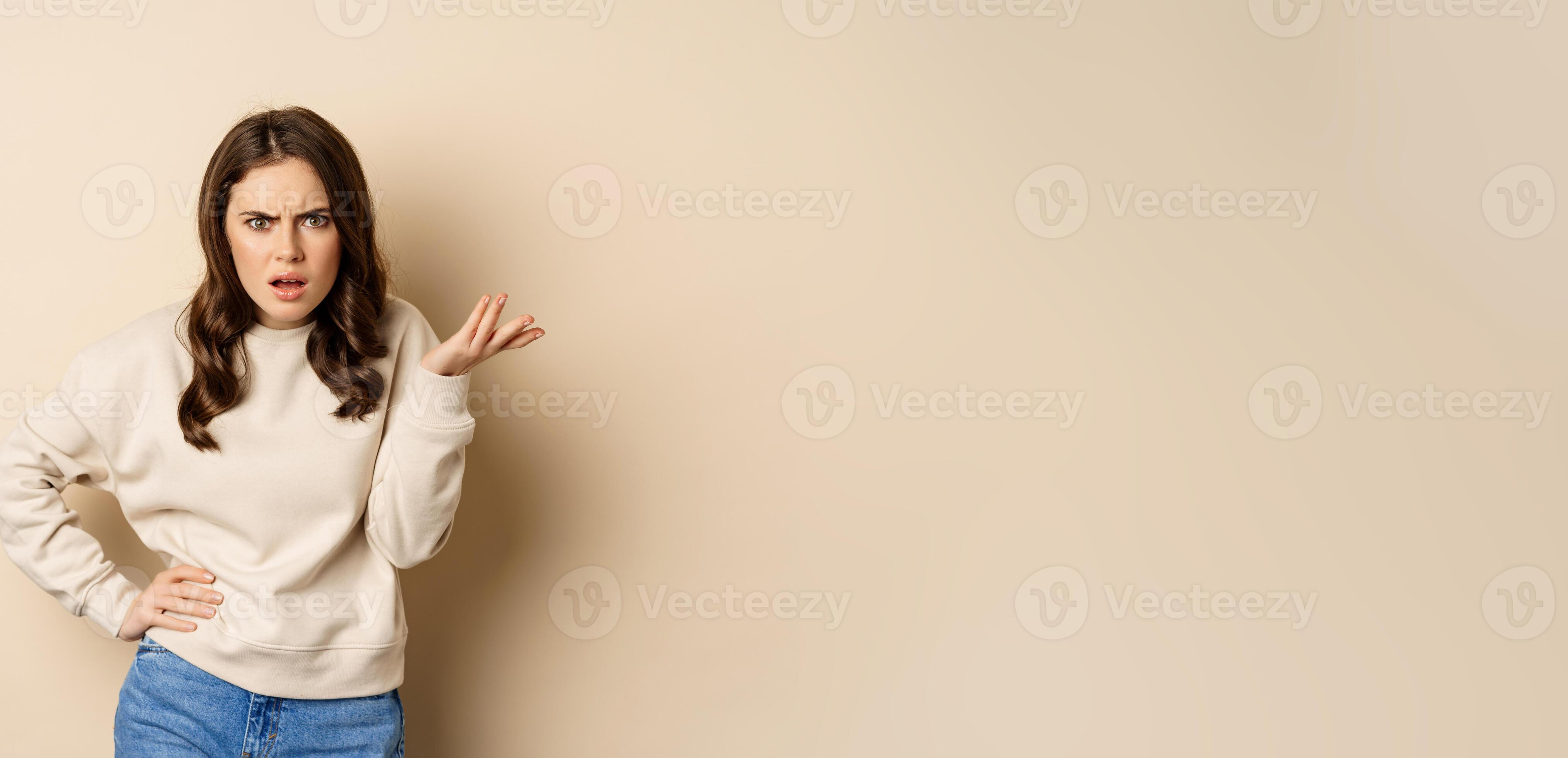 Frustrated and pissed-off woman, looking confused, arguing, standing ...