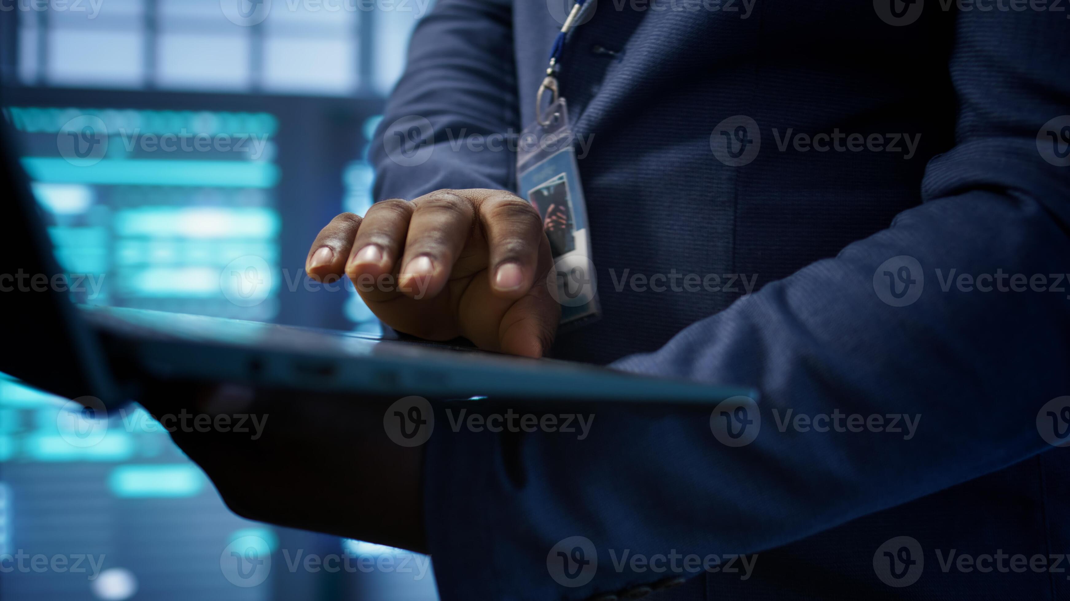 It Technician Working On Notebook In Data Center Overseeing Server