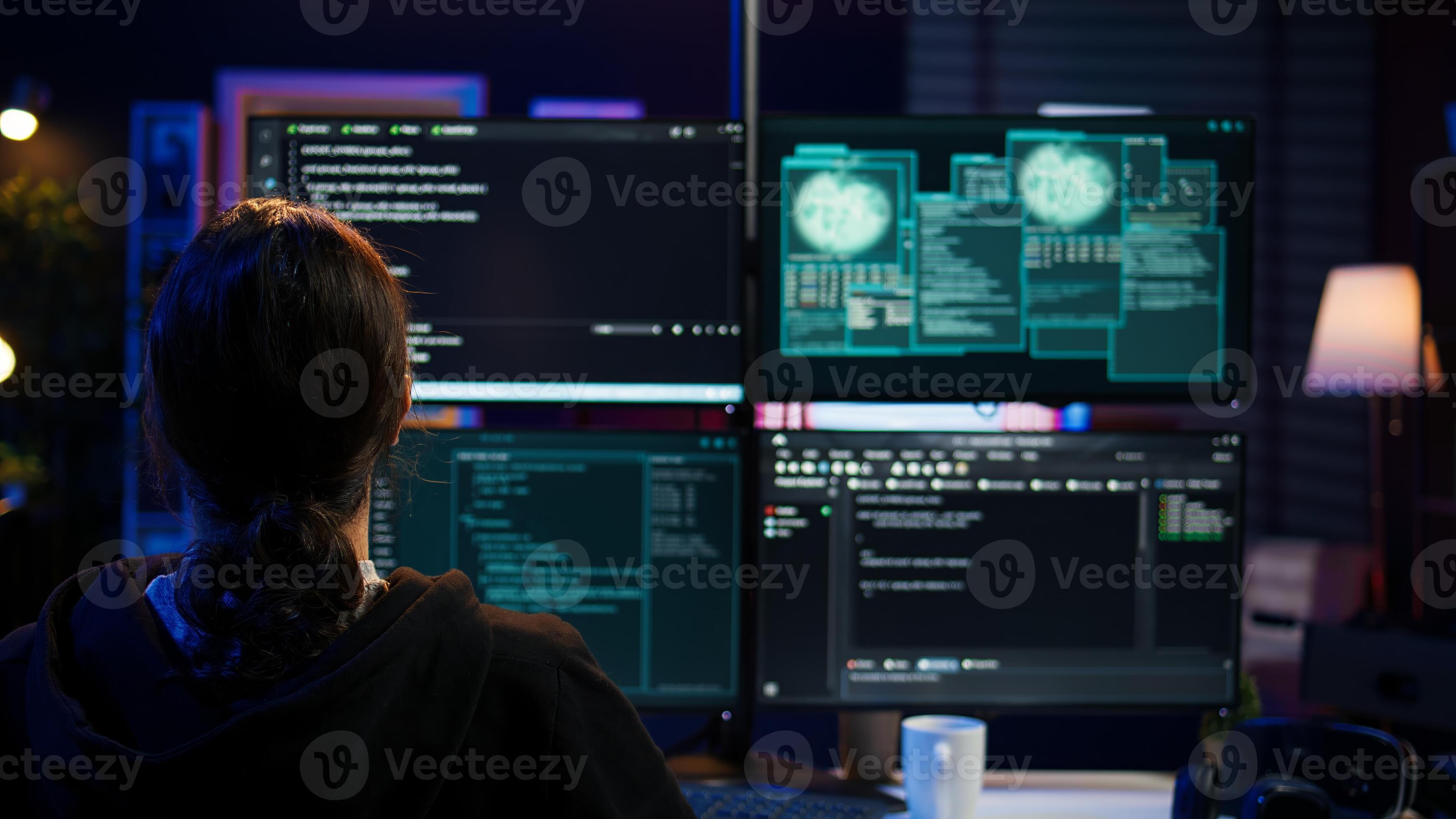 Dangerous hacker writing lines of code on PC from secret apartment ...