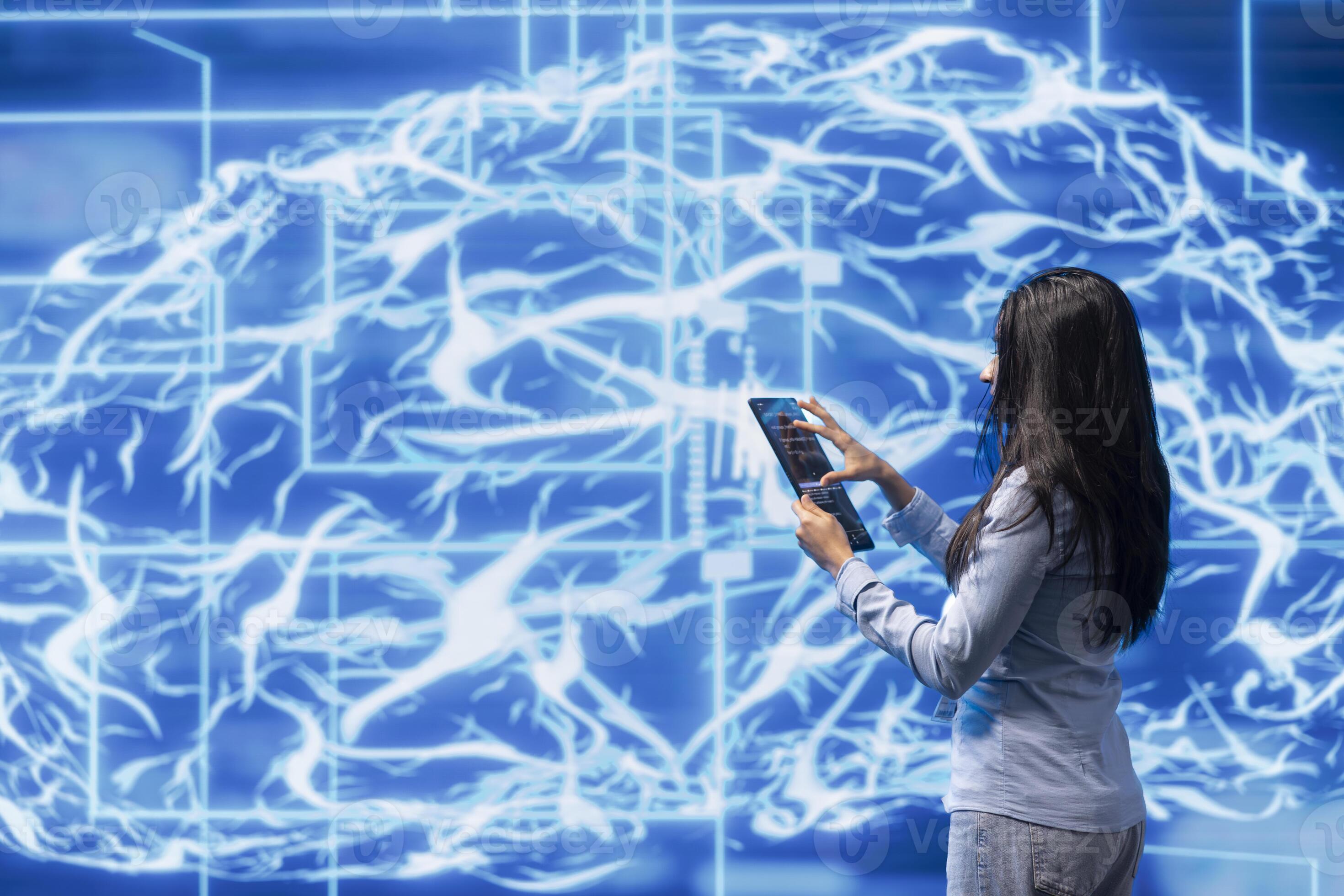 Computer scientist solving tasks on tablet, running artificial intelligence programming scripts ...