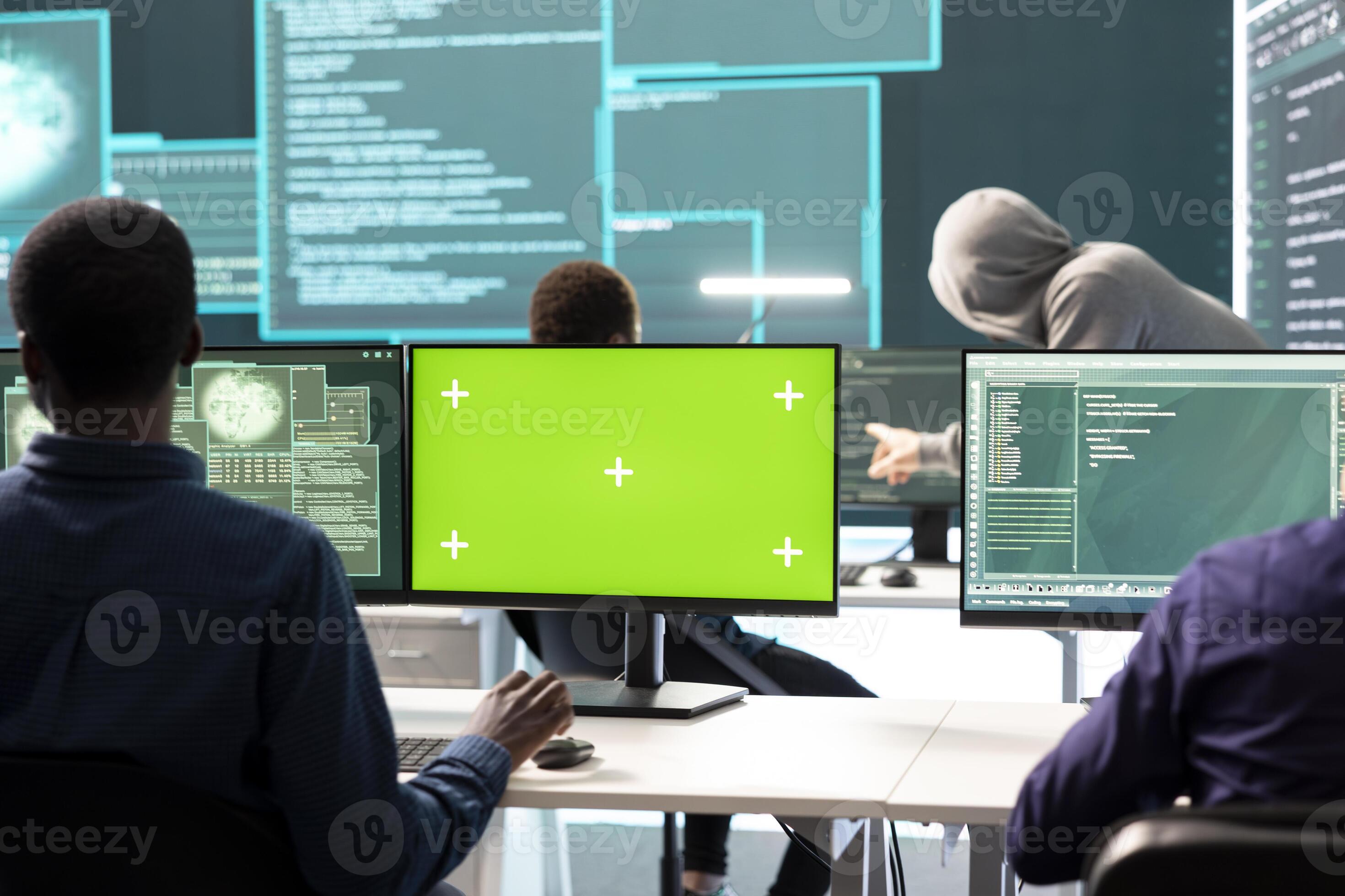 Governmental Hackers Working On Computer With Green Screen To Protect Data And Network Security