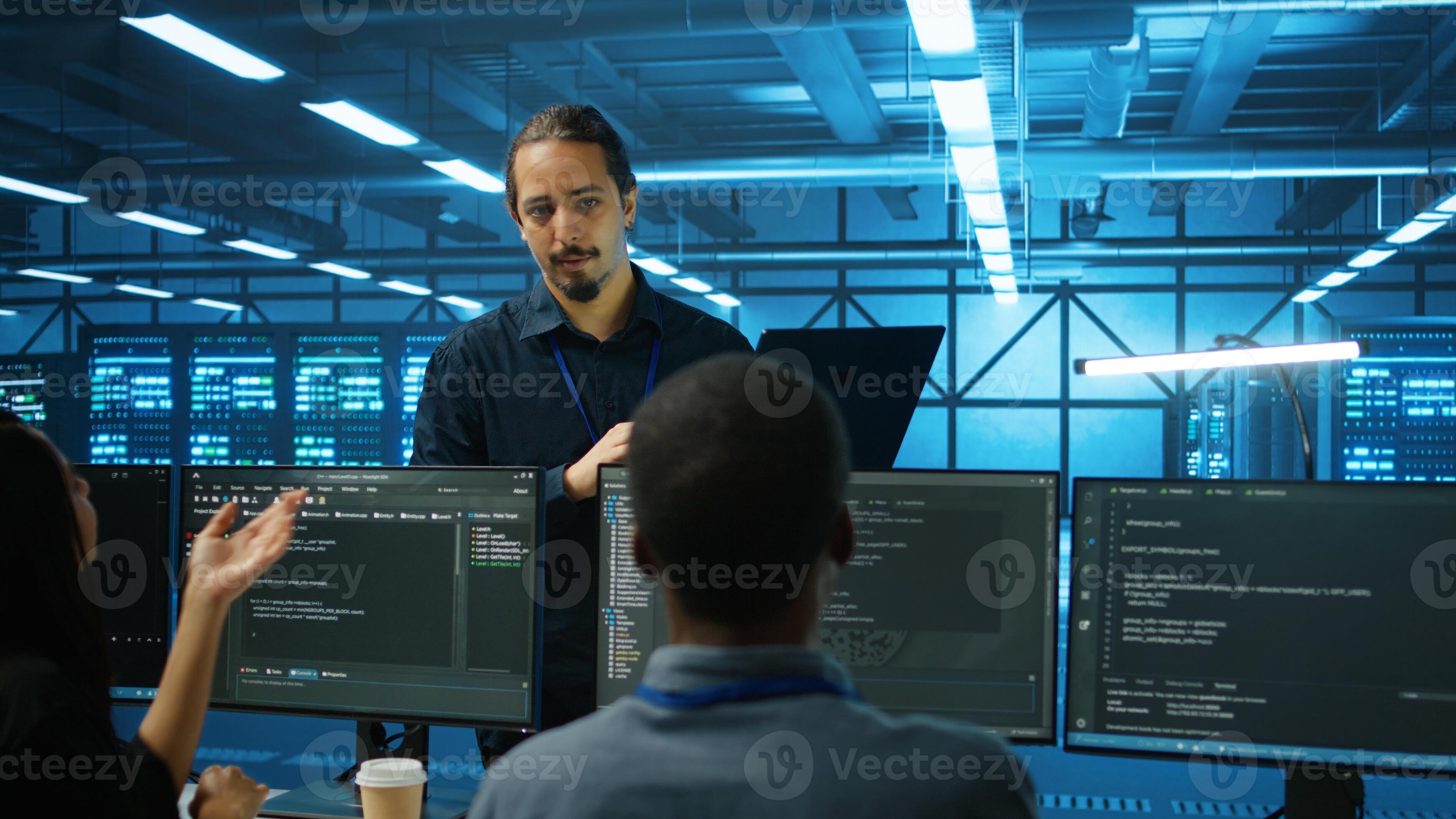Manager Supervising Multiethnic Team Working In Data Center Ensuring