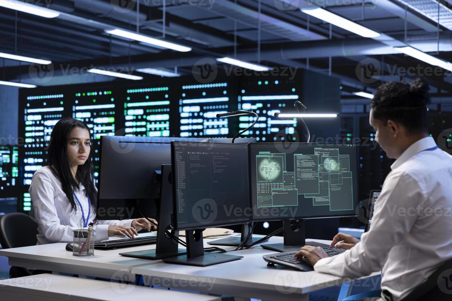 Programmers Using Computer In Server Room To Support Global Connections
