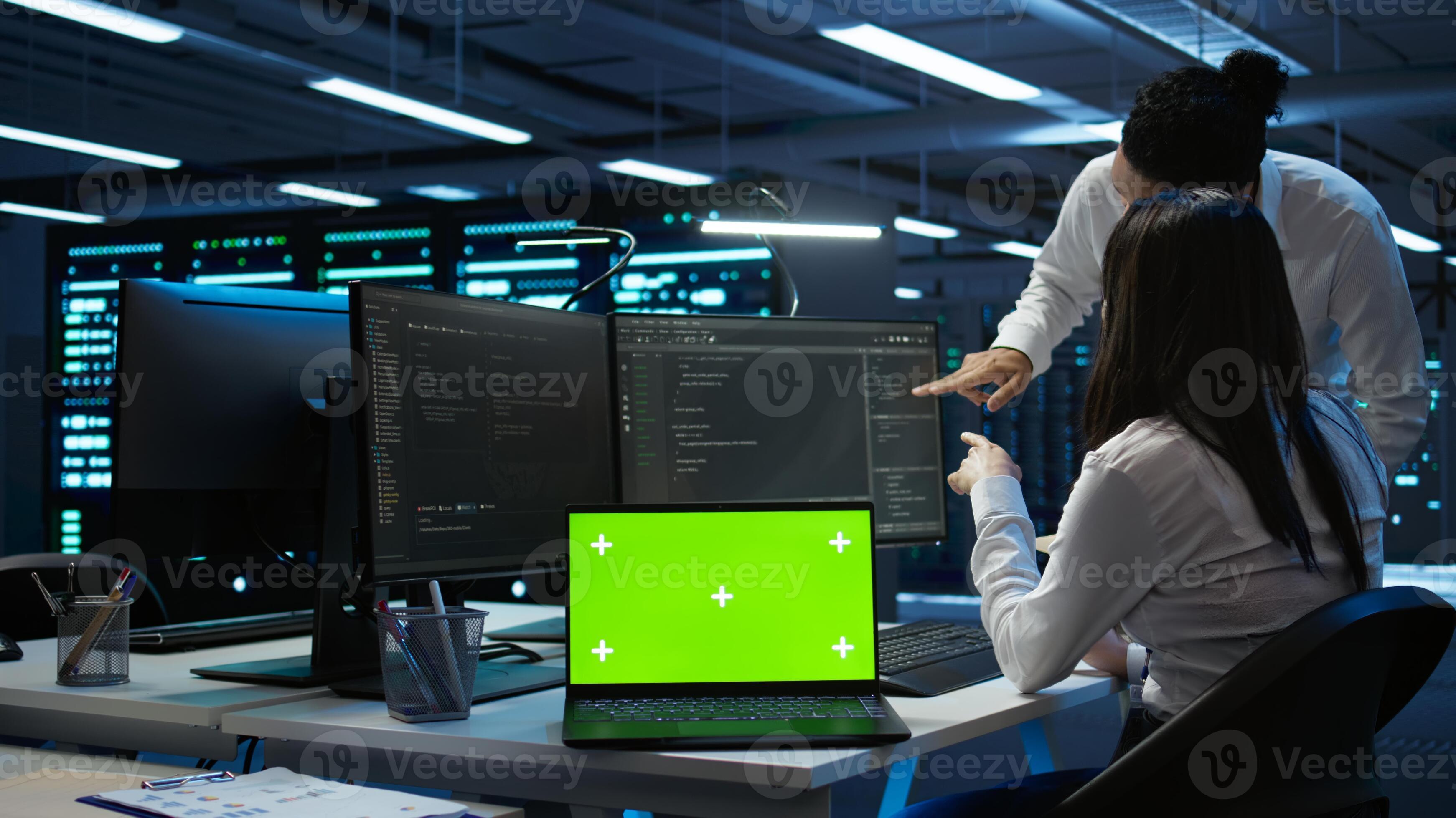 Engineer in high tech data center managing and maintaining databases using mockup devices ...