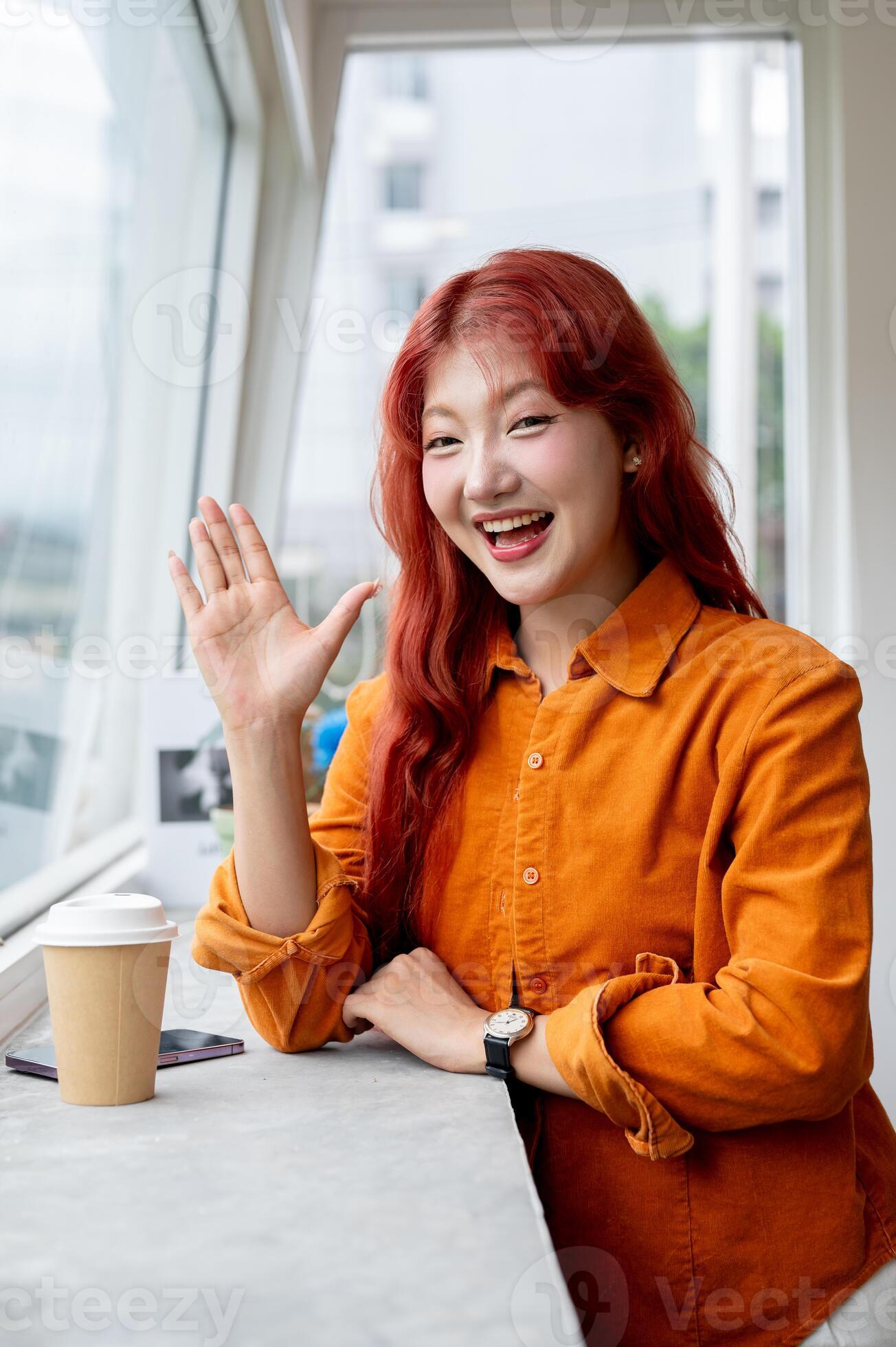 A Beautiful Asian Woman Is Standing By The Window Waving Her Hand And