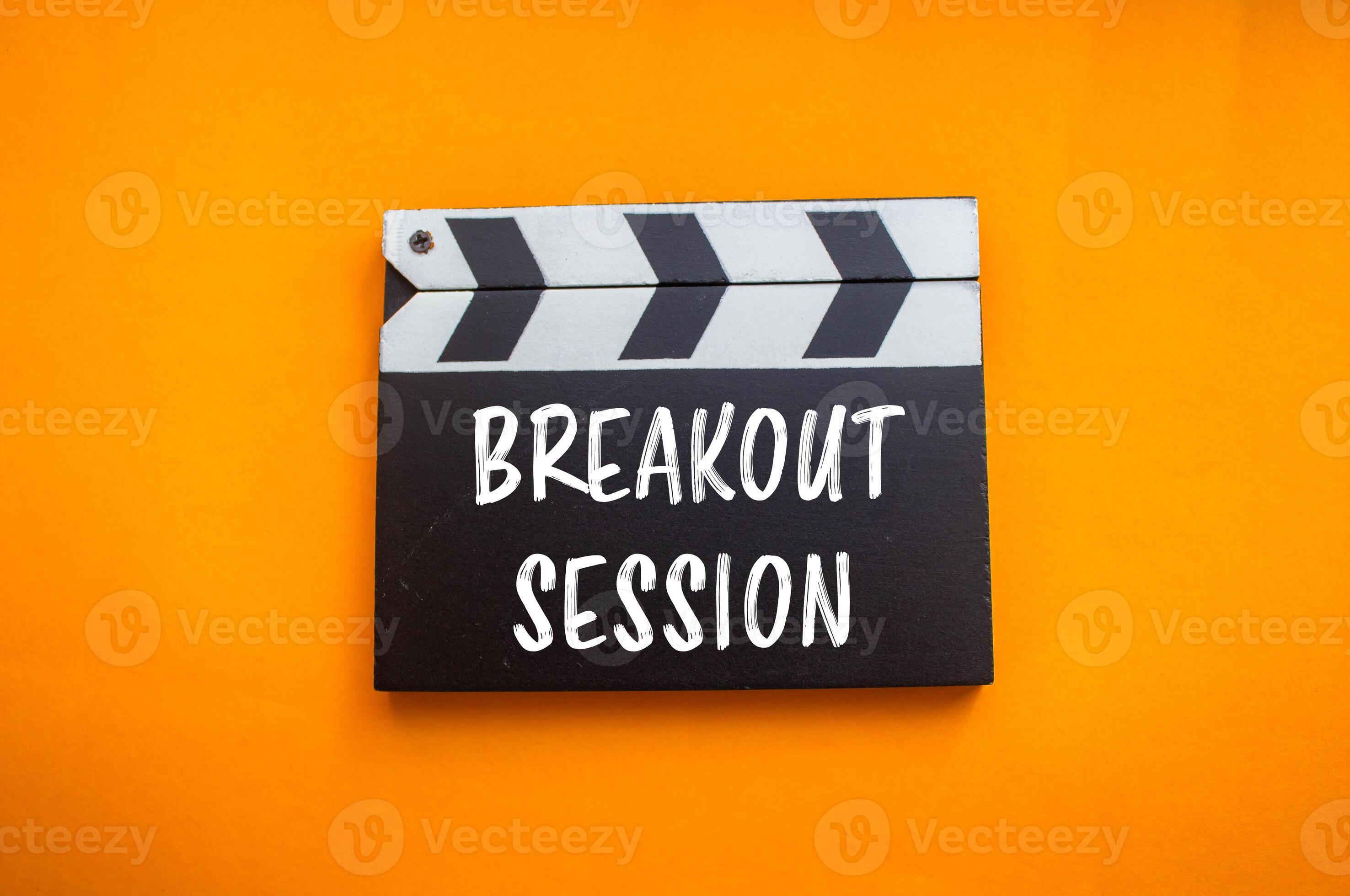 Breakout session message written on movie clapper board with orange ... Breakout session message written on movie clapper board with orange ...