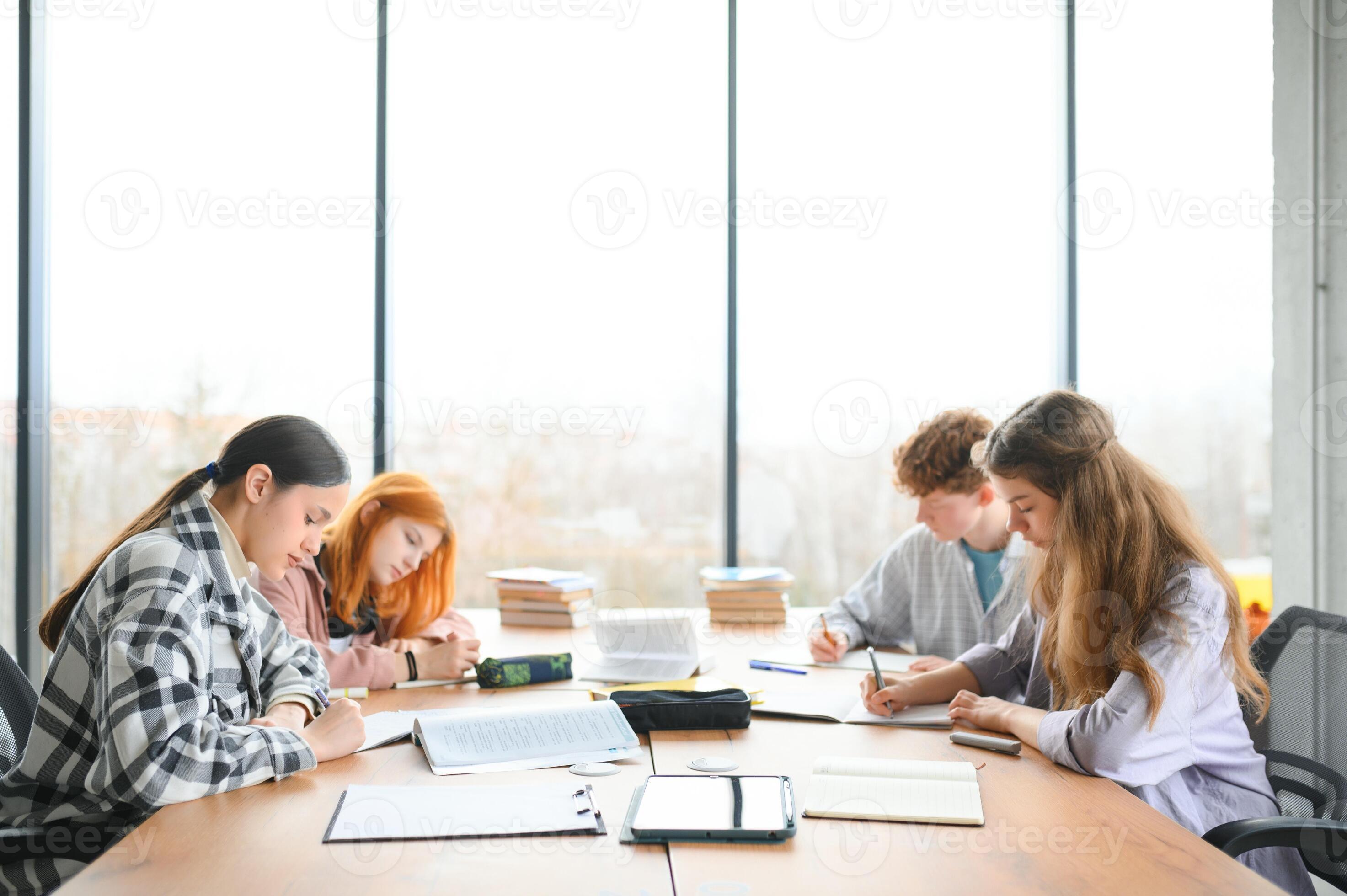Group of college students doing homework 49220858 Stock Photo at Vecteezy Group of college students doing homework 49220858 Stock Photo at Vecteezy