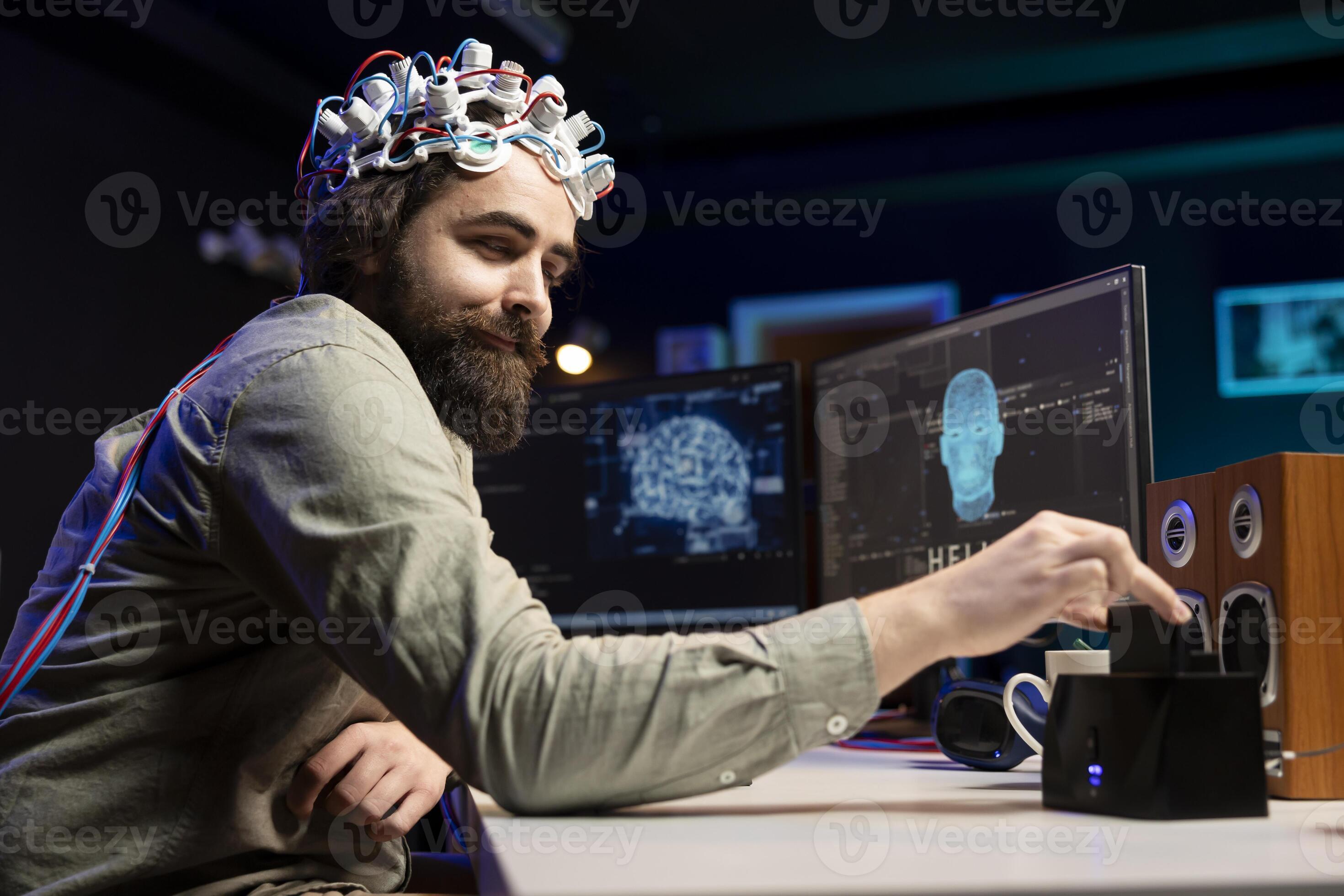 Man wearing EEG headset inserting disk into PC containing software turning AI into sentient ...