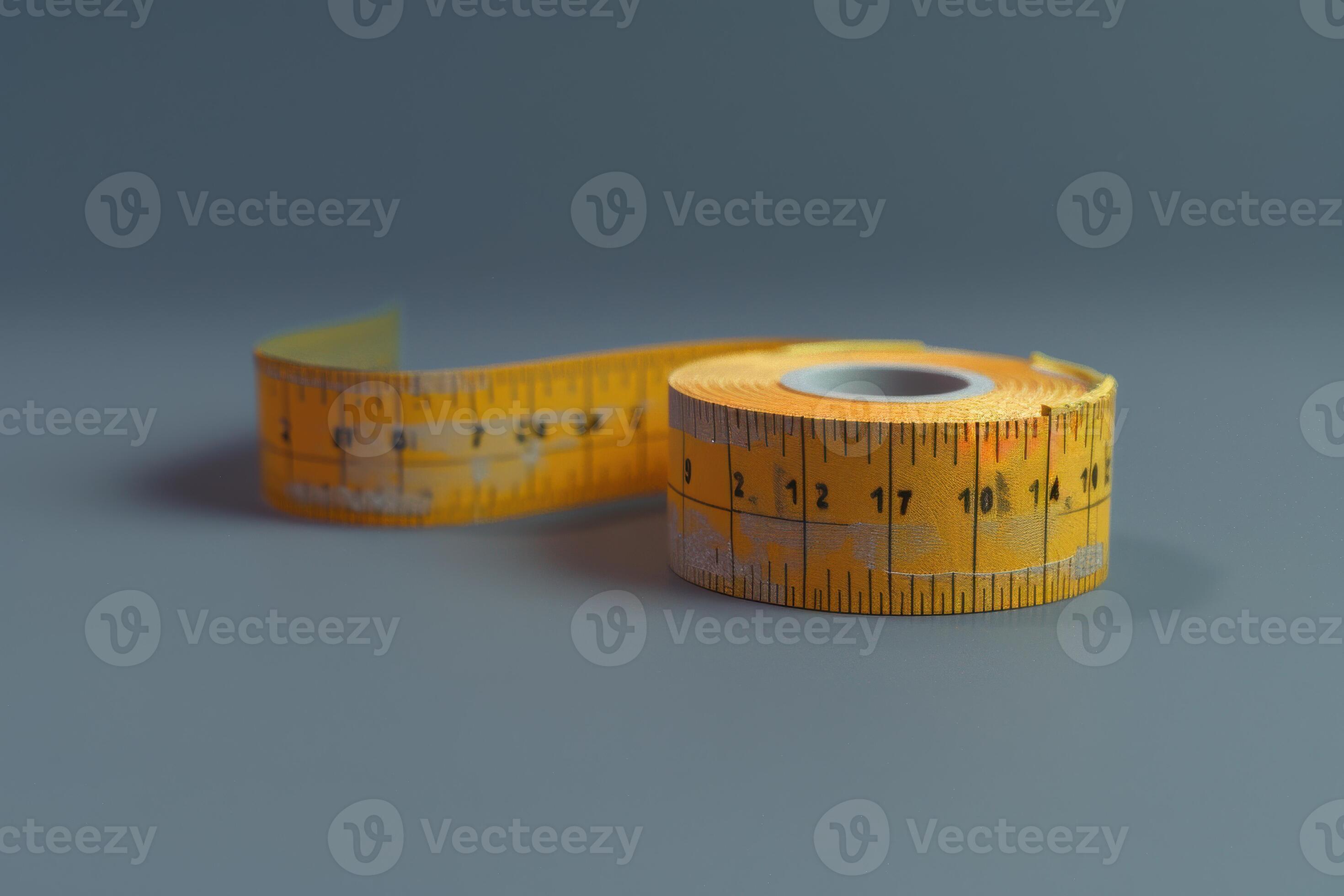 Measuring tape coiled on a flat surface with clear markings 49414775 ... Measuring tape coiled on a flat surface with clear markings 49414775 ...