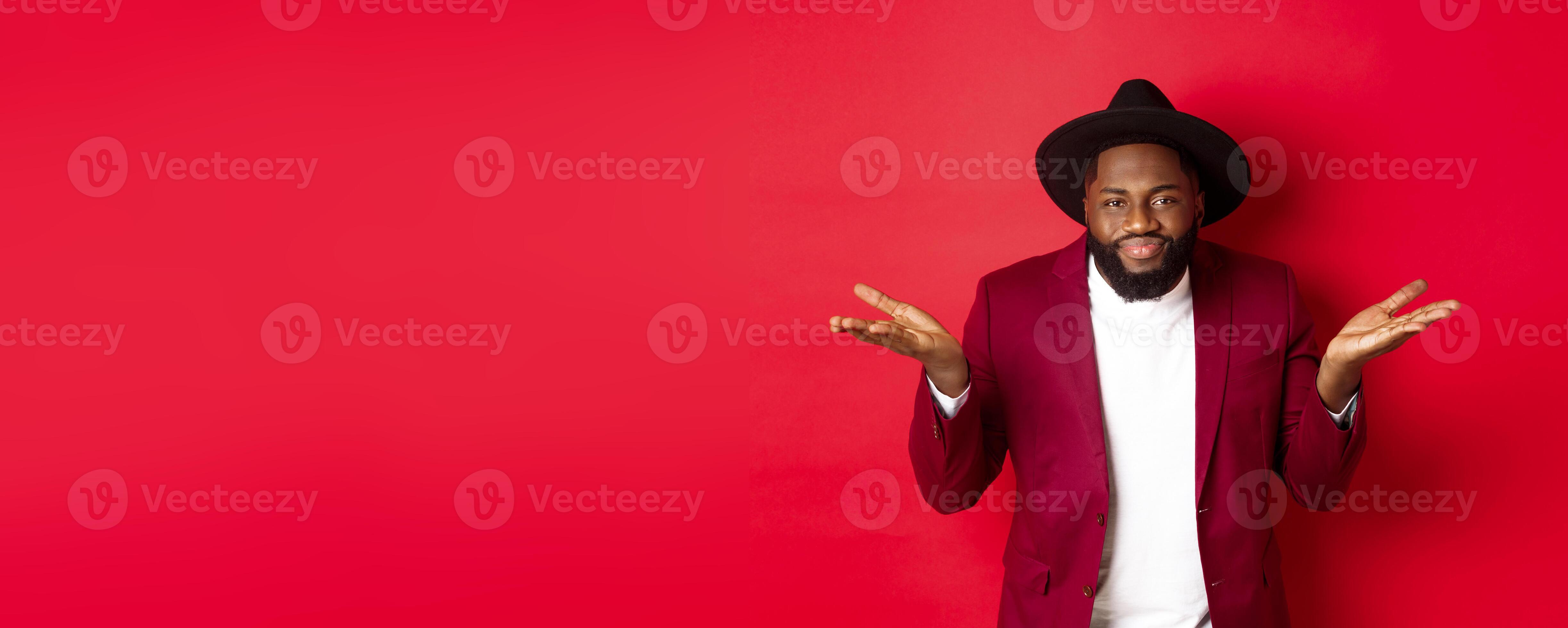 Clueless and unbothered Black man shrugging with indifferent look, dont ...