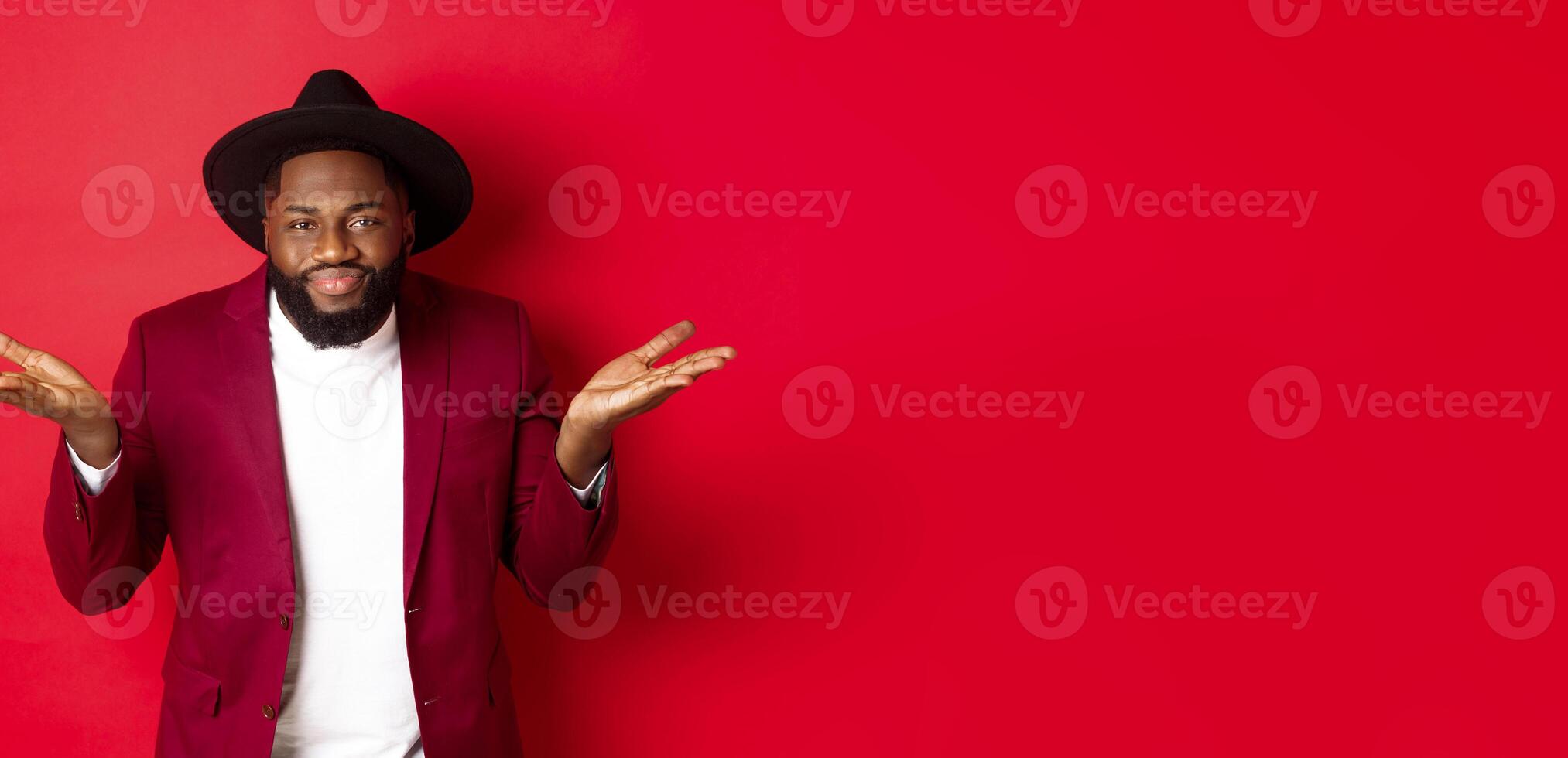 Clueless and unbothered Black man shrugging with indifferent look, dont ...