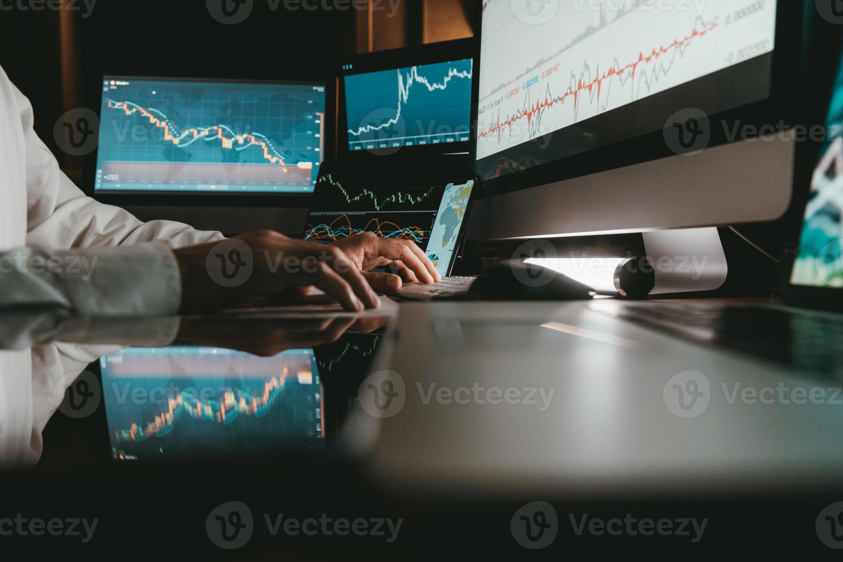 Close-up of male trader typing on computer keyboard while trading on ...