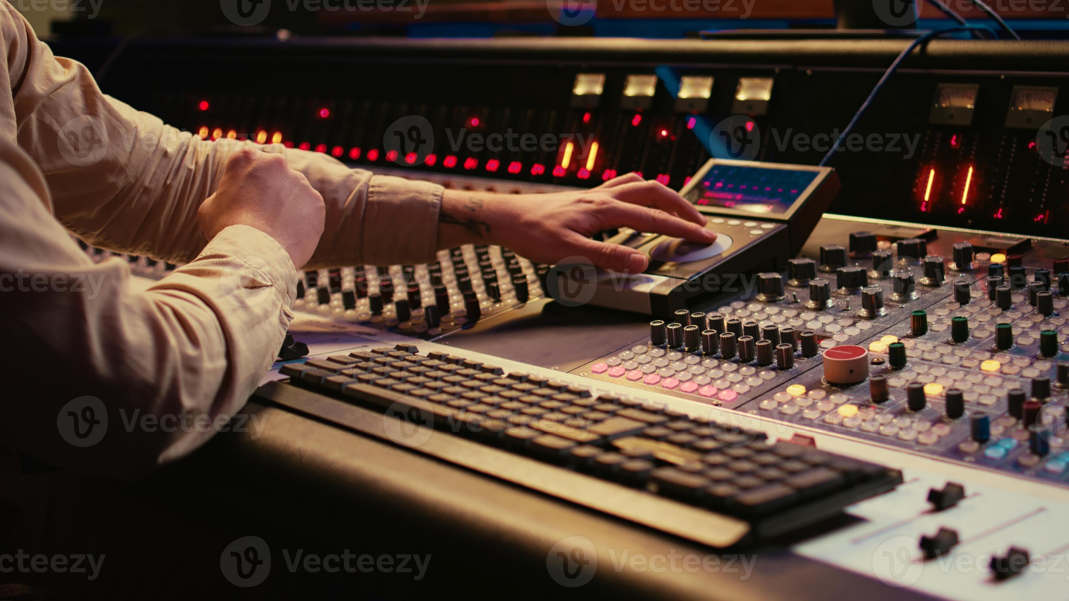 Audio Technician Uses Mixing Console And Faders In Control Room Remote