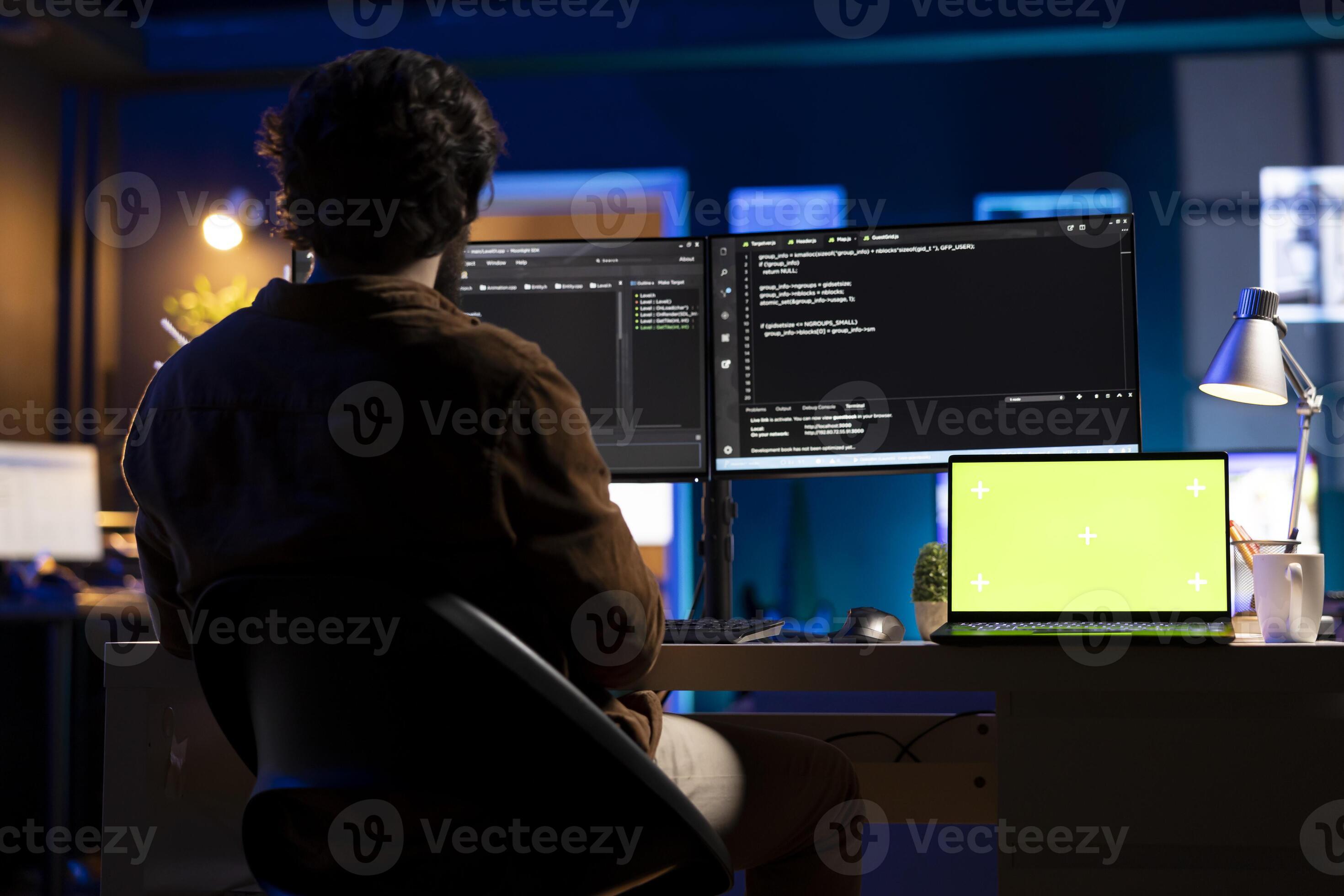 Programmer designing and developing software applications using ... Programmer designing and developing software applications using ...