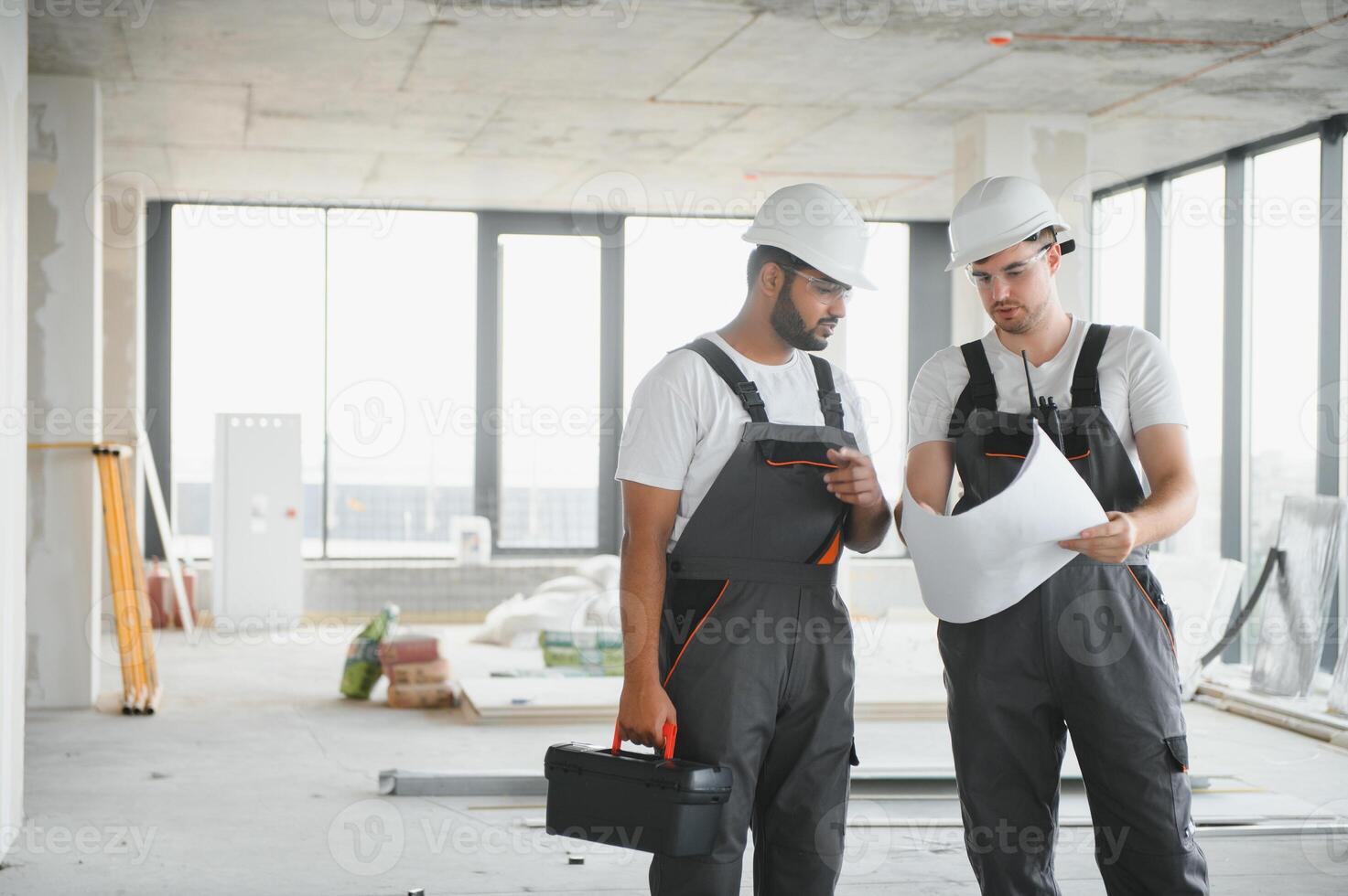 Happy multicultural builders in hardhats 49771159 Stock Photo at Vecteezy