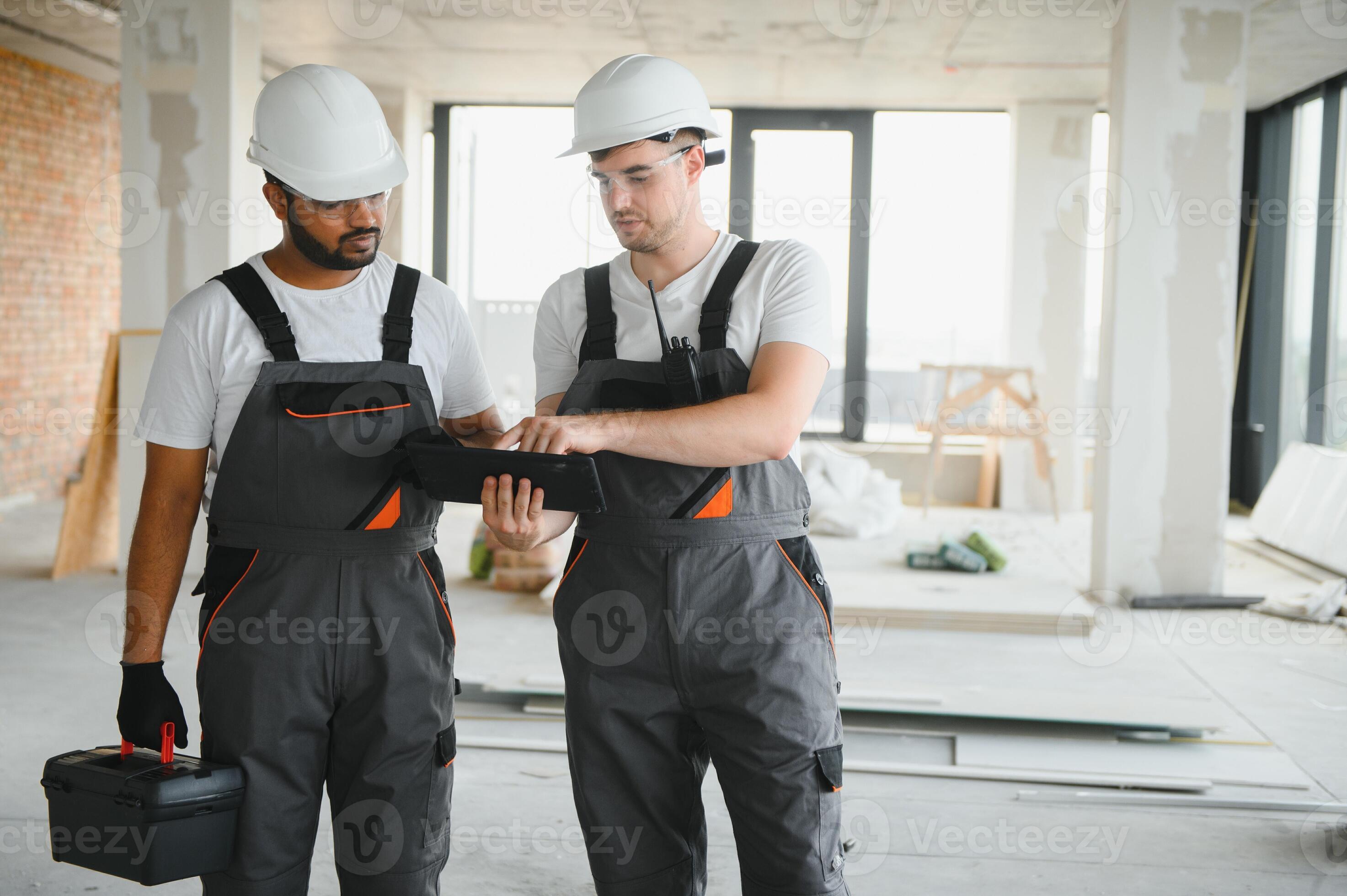 multicultural builders in hardhats at construction site 49771161 Stock Photo at Vecteezy