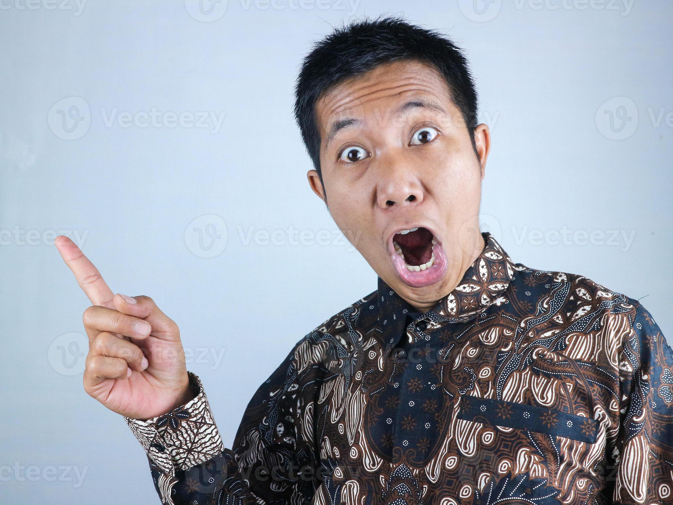 wow, surprised face expression asian man wearing batik clothes looking ...