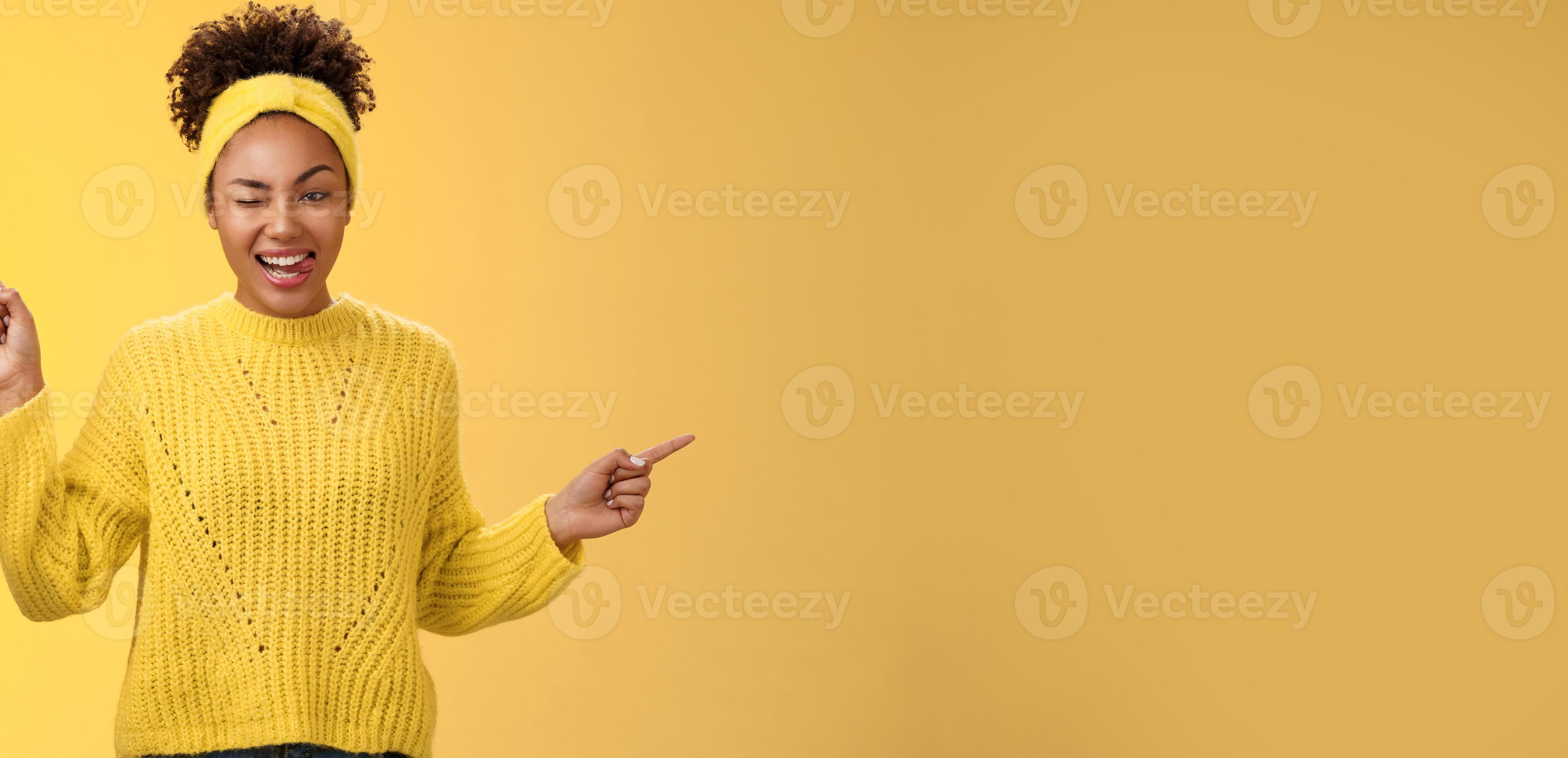 Cheeky flirty good-looking confident young black woman pointing ...