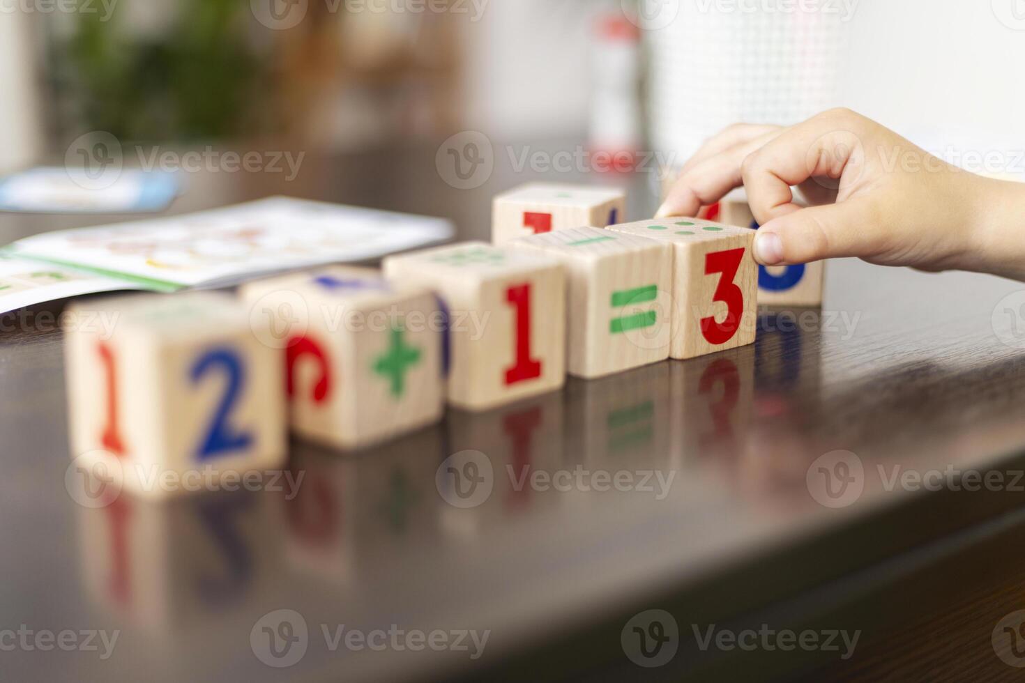 Child arranging number blocks for math 49991420 Stock Photo at Vecteezy