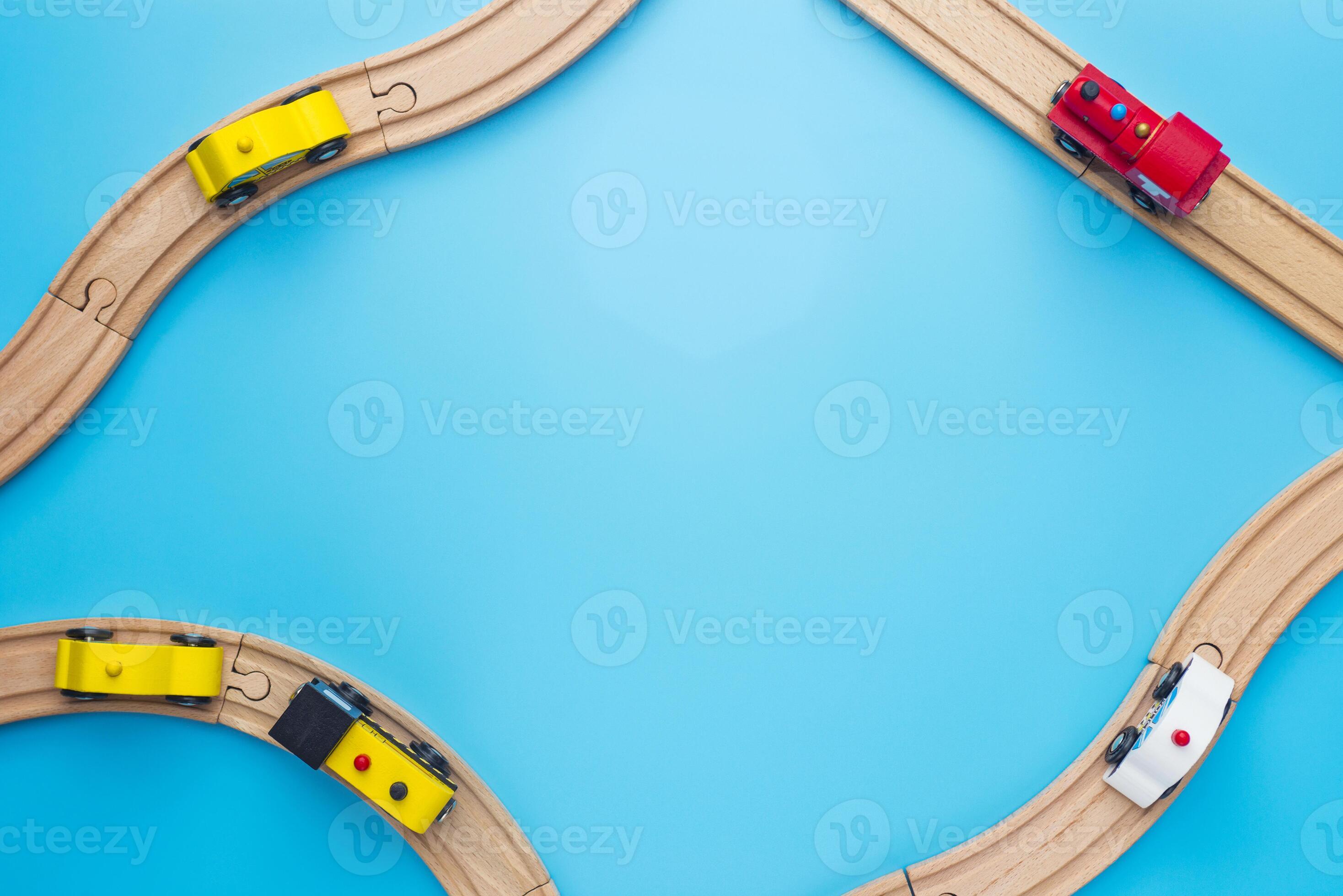 Baby kid toys background. Toy train and wooden rails on blue background 49991534 Stock Photo at ...