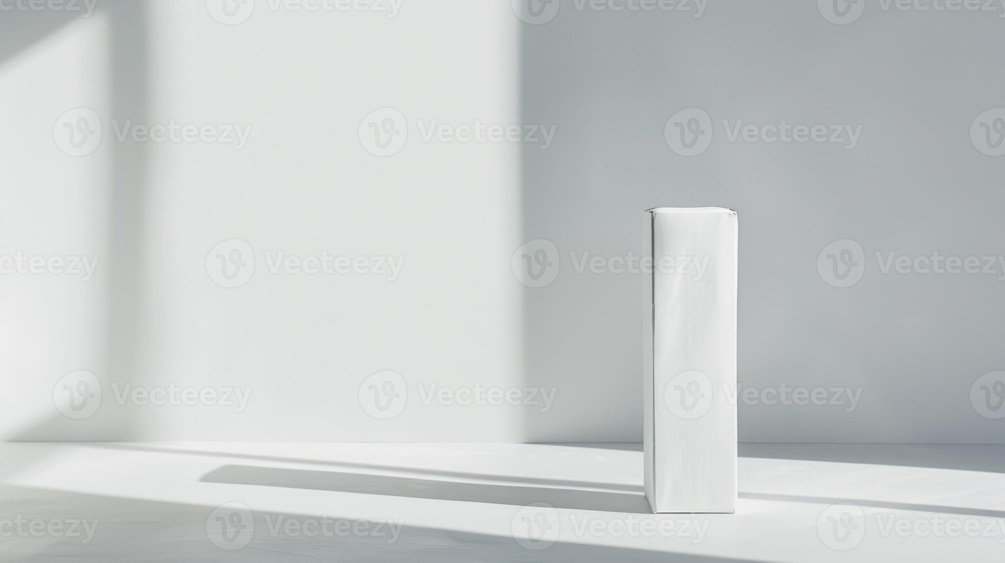 A simple white rectangular object stands upright in a softly ...
