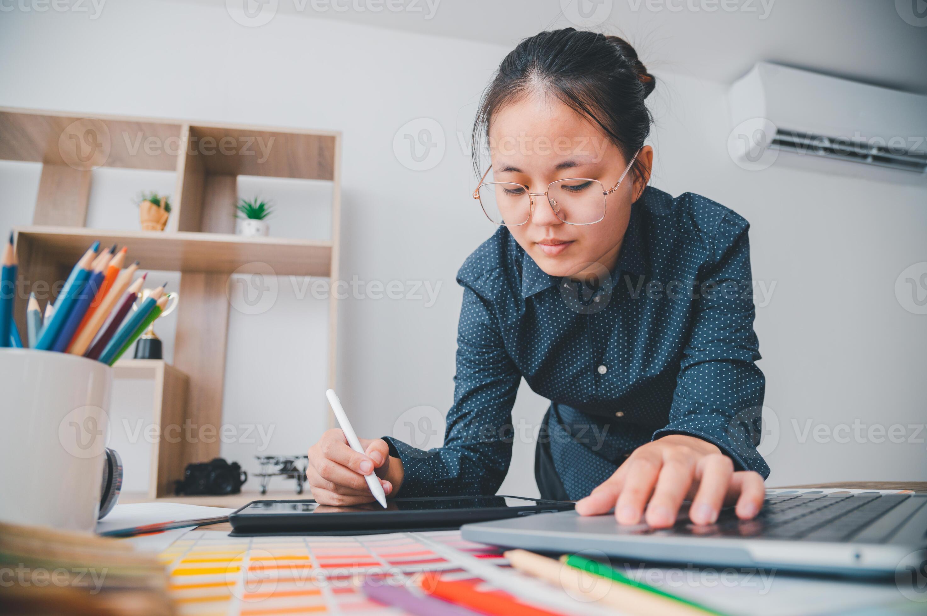 Graphic Designer Architects Who Work With Laptops And Color Comparison Tables For Design Work