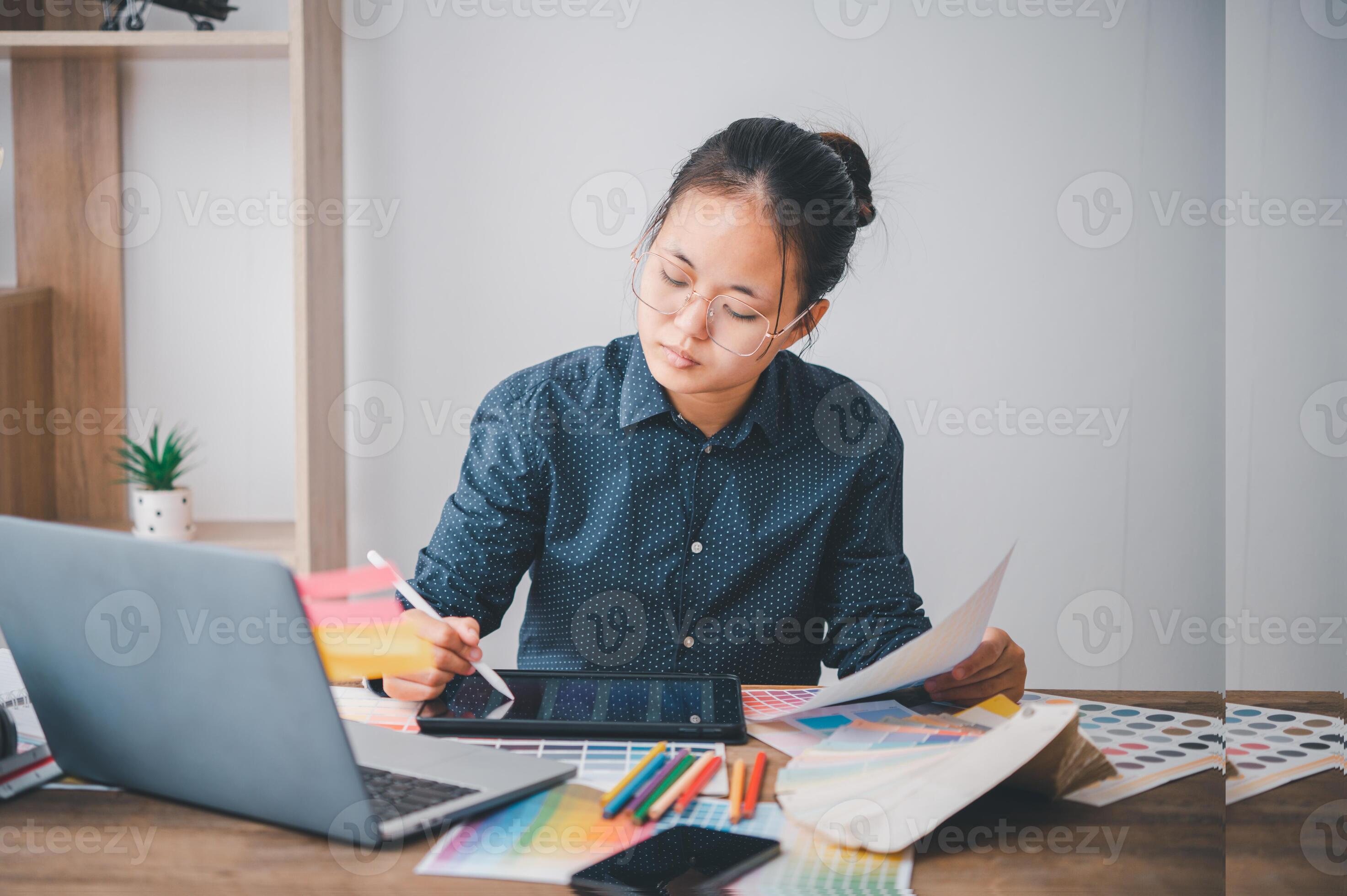 Graphic Designer Architects Who Work With Laptops And Color Comparison Tables For Design Work