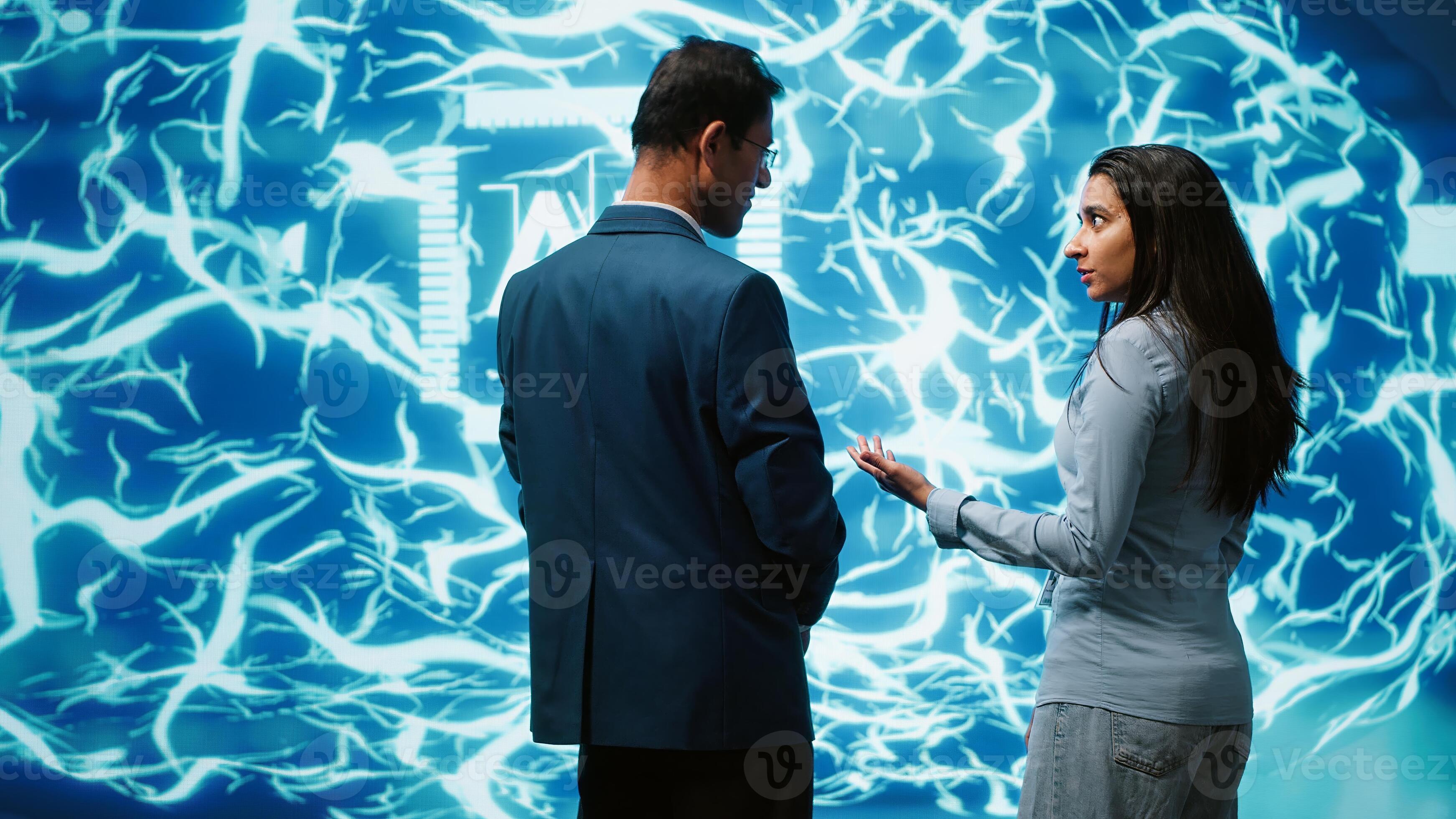 Teamworking colleagues implementing artificial intelligence parallel processing, breaking up ...