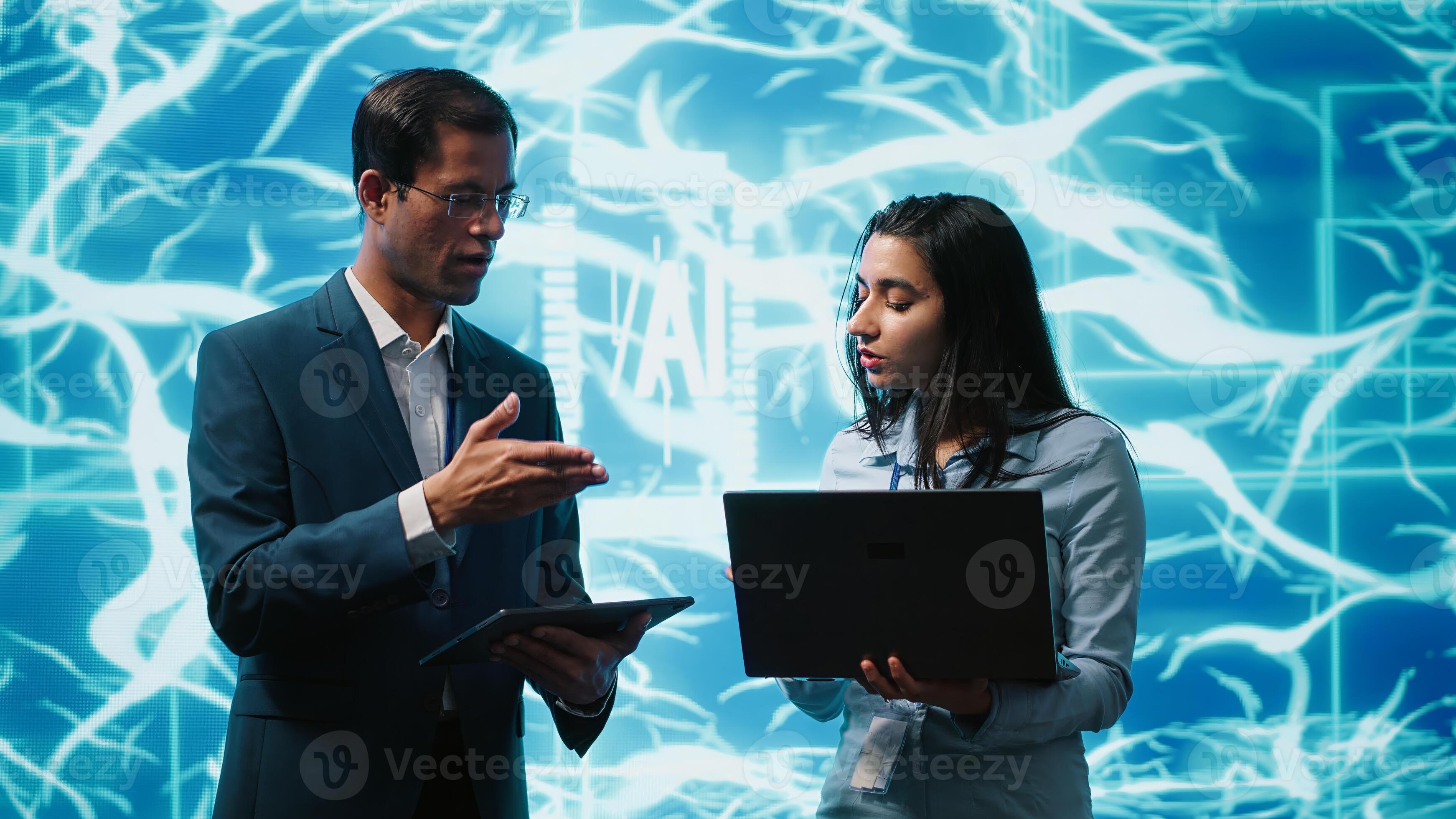Coworkers Solving Tasks On Laptop And Tablet Running Artificial Intelligence Programming
