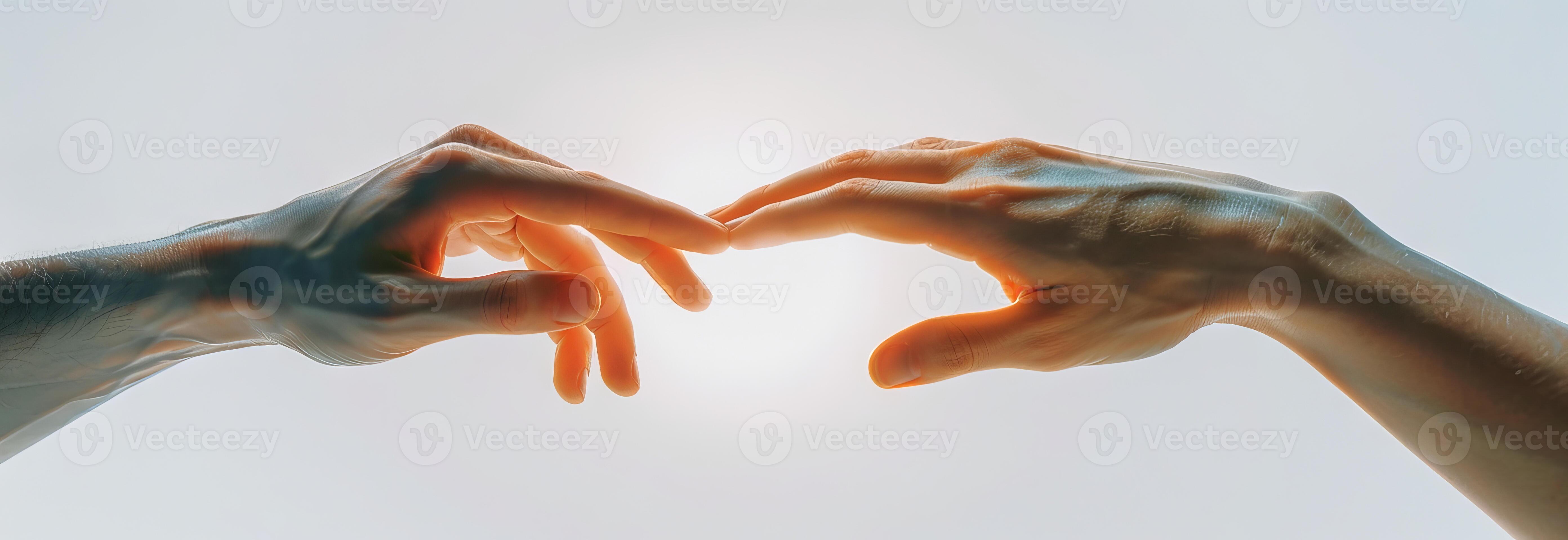 Two hands reaching towards each other in a soft light. Concept of human connection, support ...