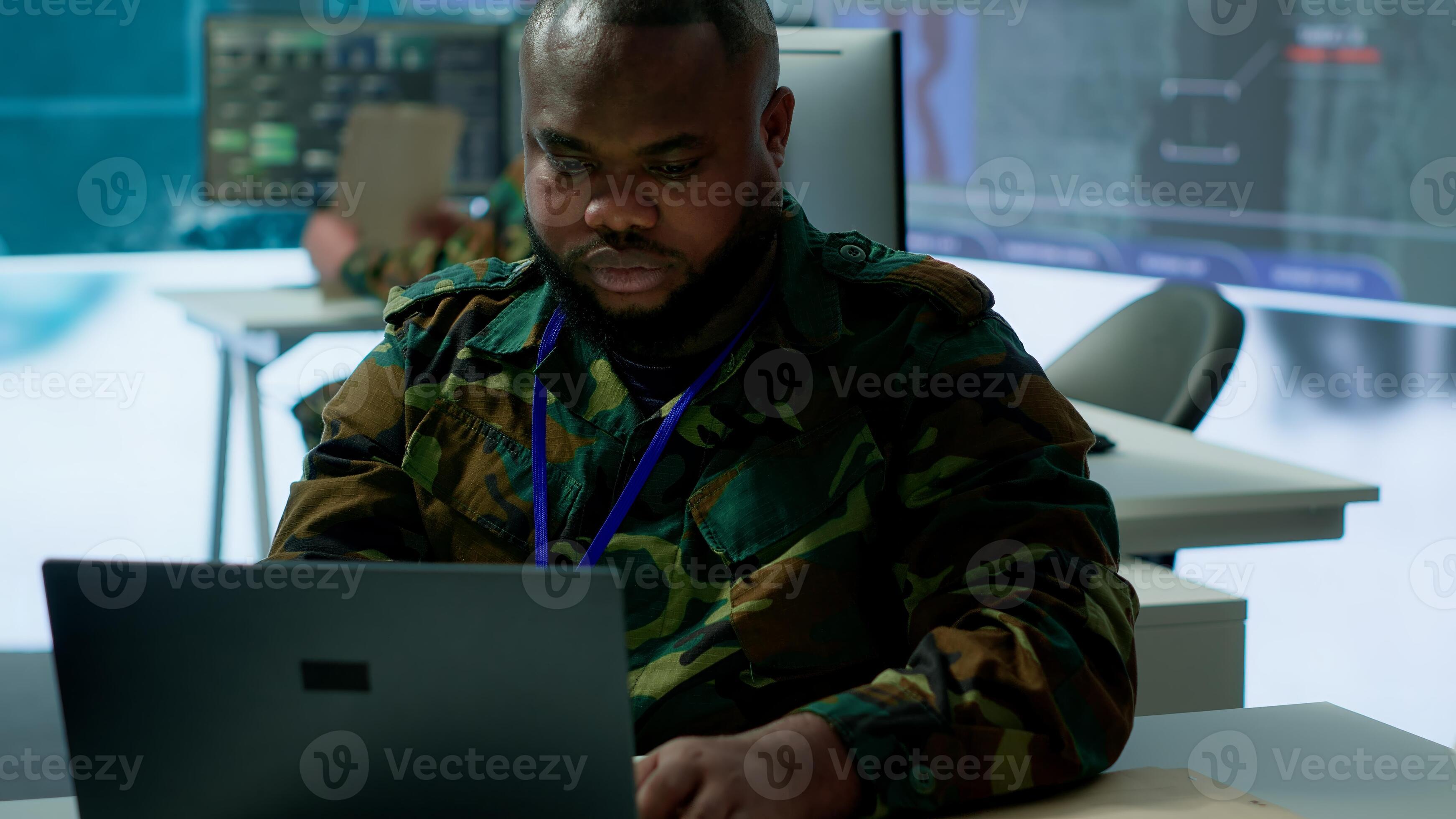 It Analyst In A High Tech Base Of Operations Handling Surveillance Activity And Ensuring