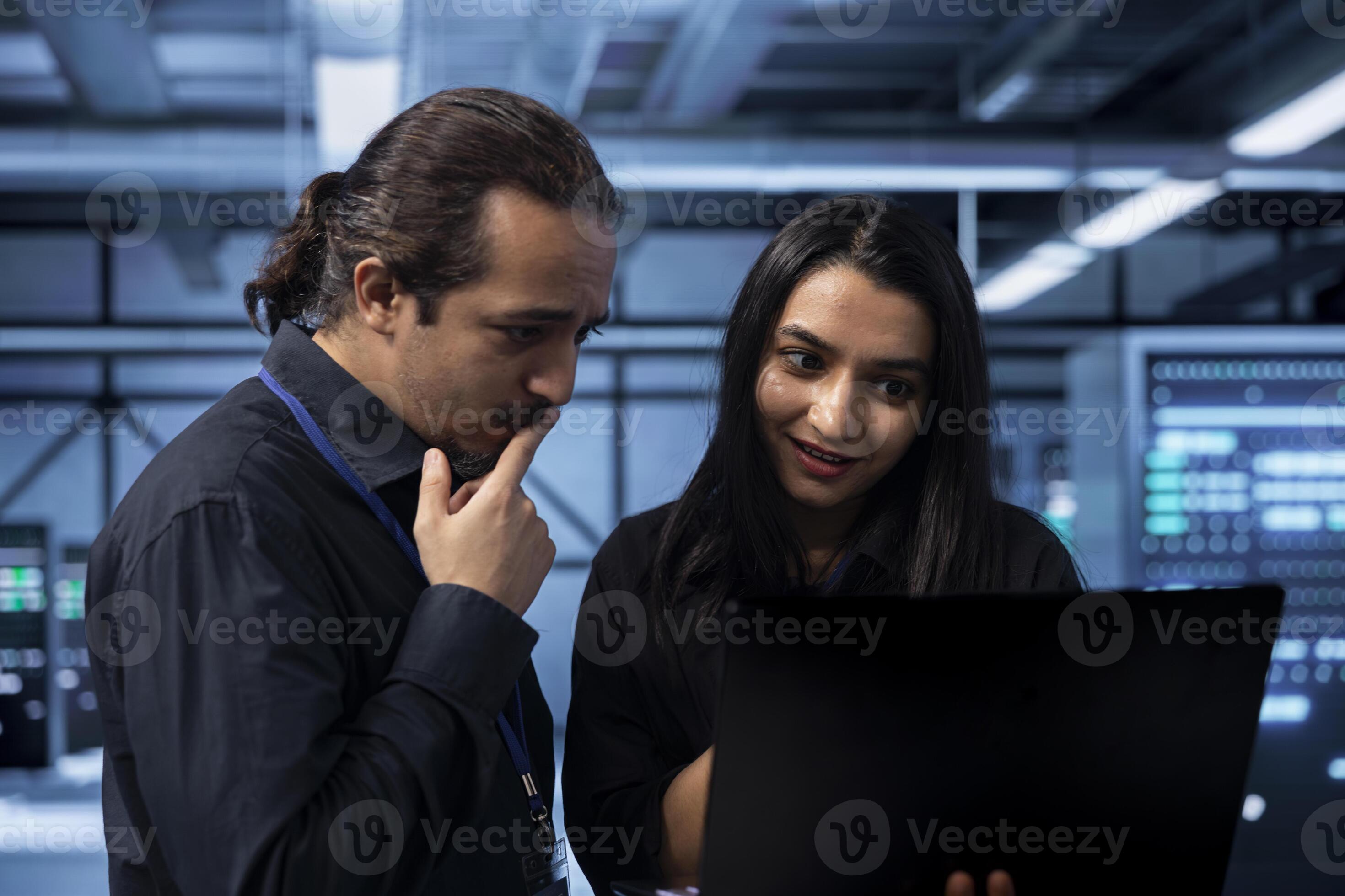 IT experts in server hub doing brainstorming, finding ways to ensure data remains shielded from ...