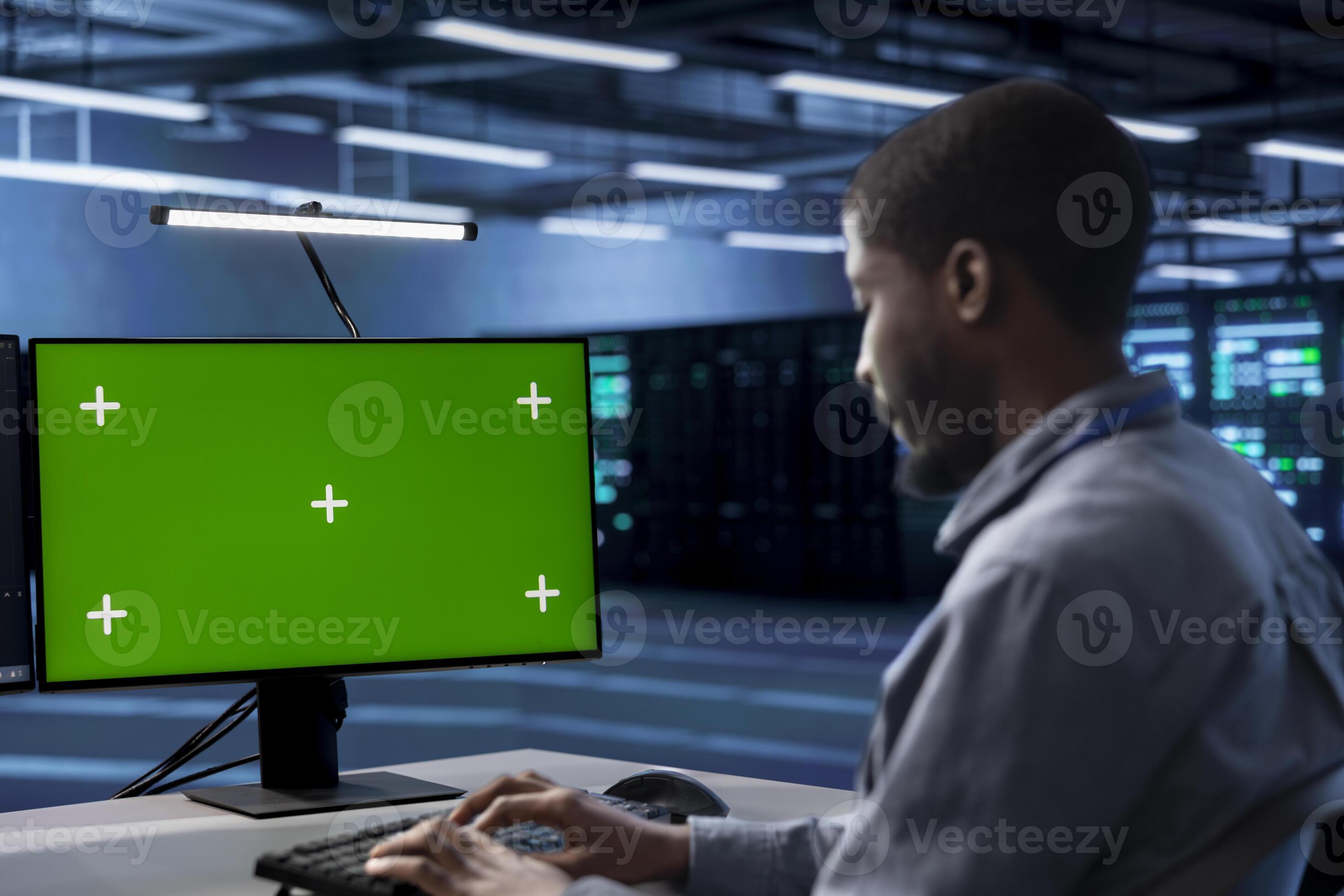 Technician In Server Hub Ensuring Data Remains Shielded From Potential Threats Using Green