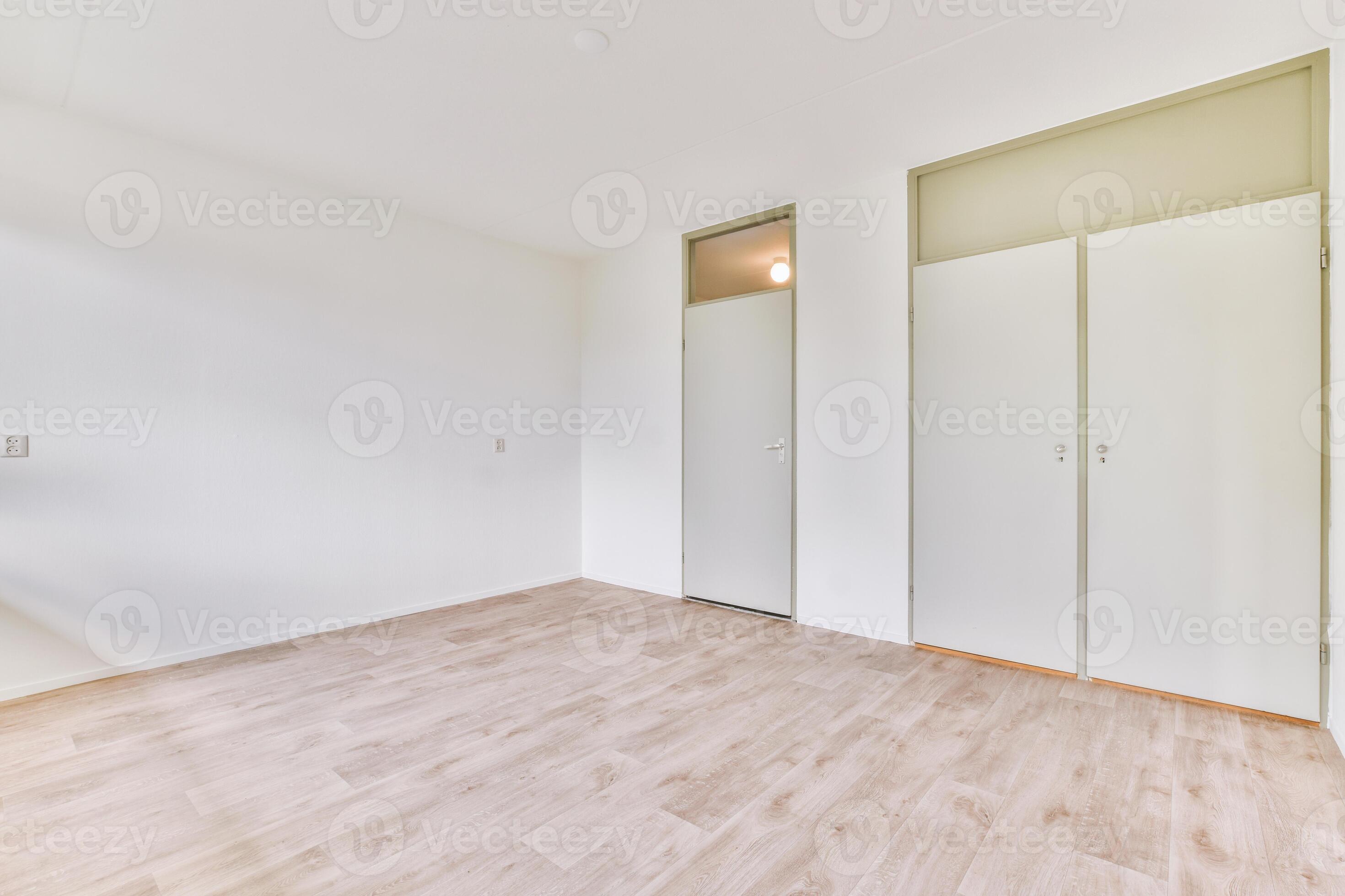 An empty room with white walls and wooden floors 50283334 Stock Photo at Vecteezy