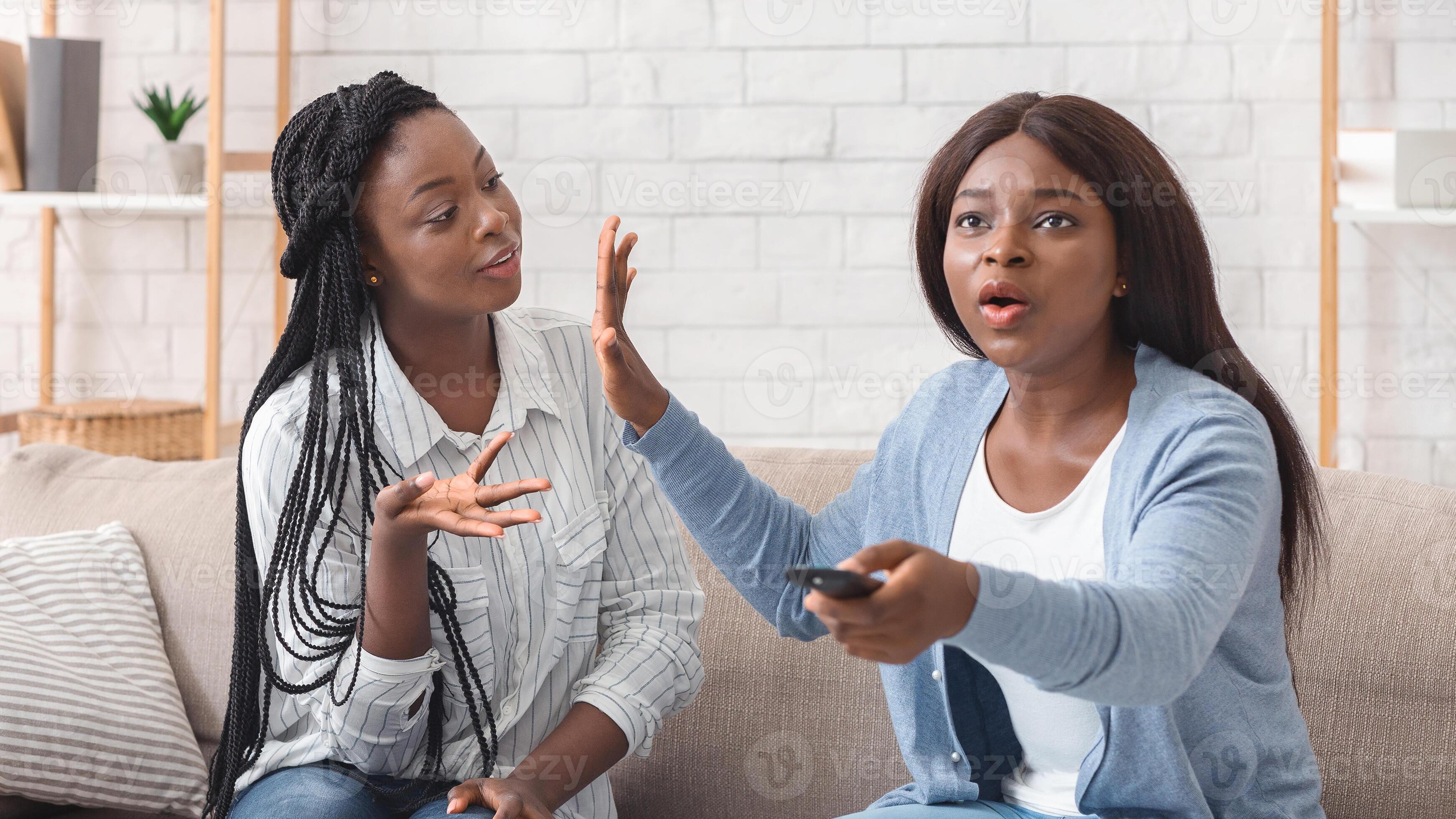 Indifference in Friendship. Young Black Woman Watching Television Not ...